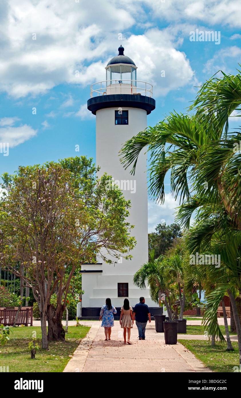Family walking towards Punta Higuero Lighthouse, Rincon, Puerto Rico ...