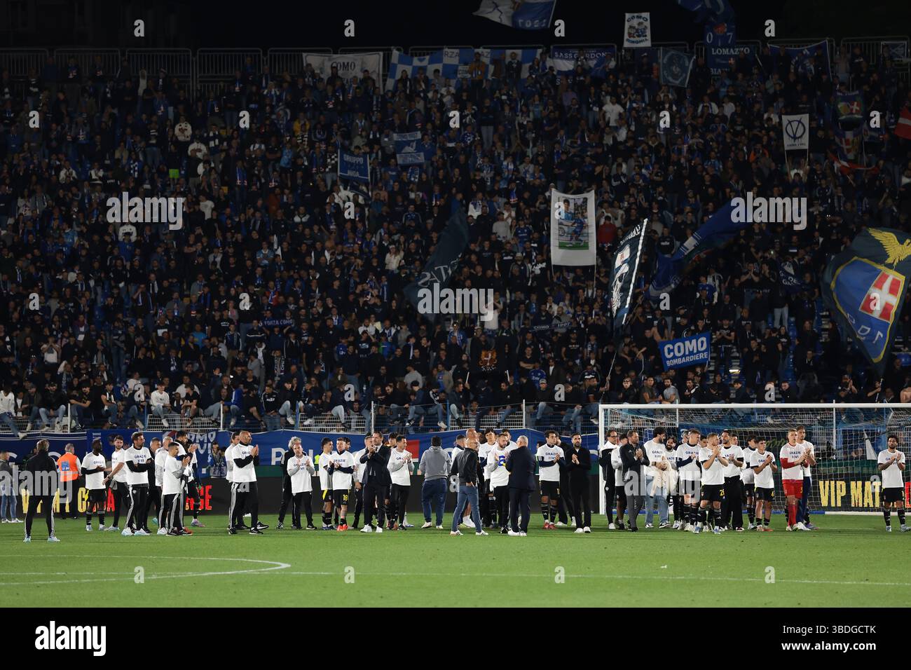 Como, Italy. 23rd May, 2025. Como 1907 players parade the pitch to ...