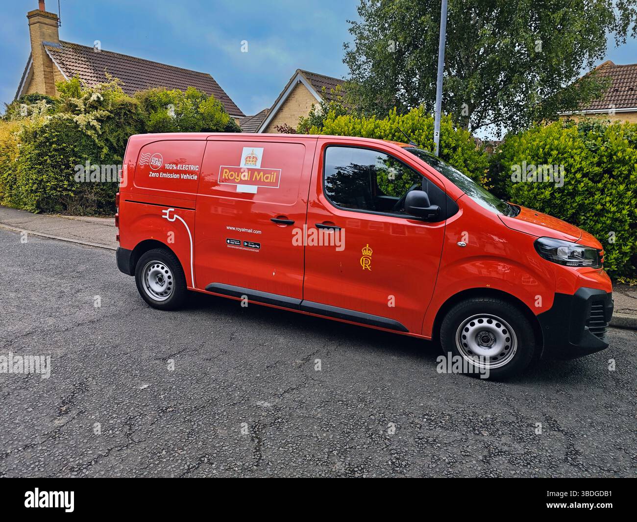 New King Charles livery of electric Royal Mail red post van Stock Photo ...