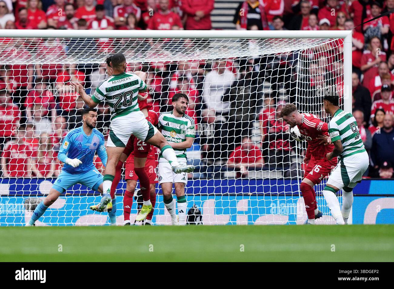 Celtic's Cameron Carter-Vickers heads the ball onto Aberdeen's Alfie ...