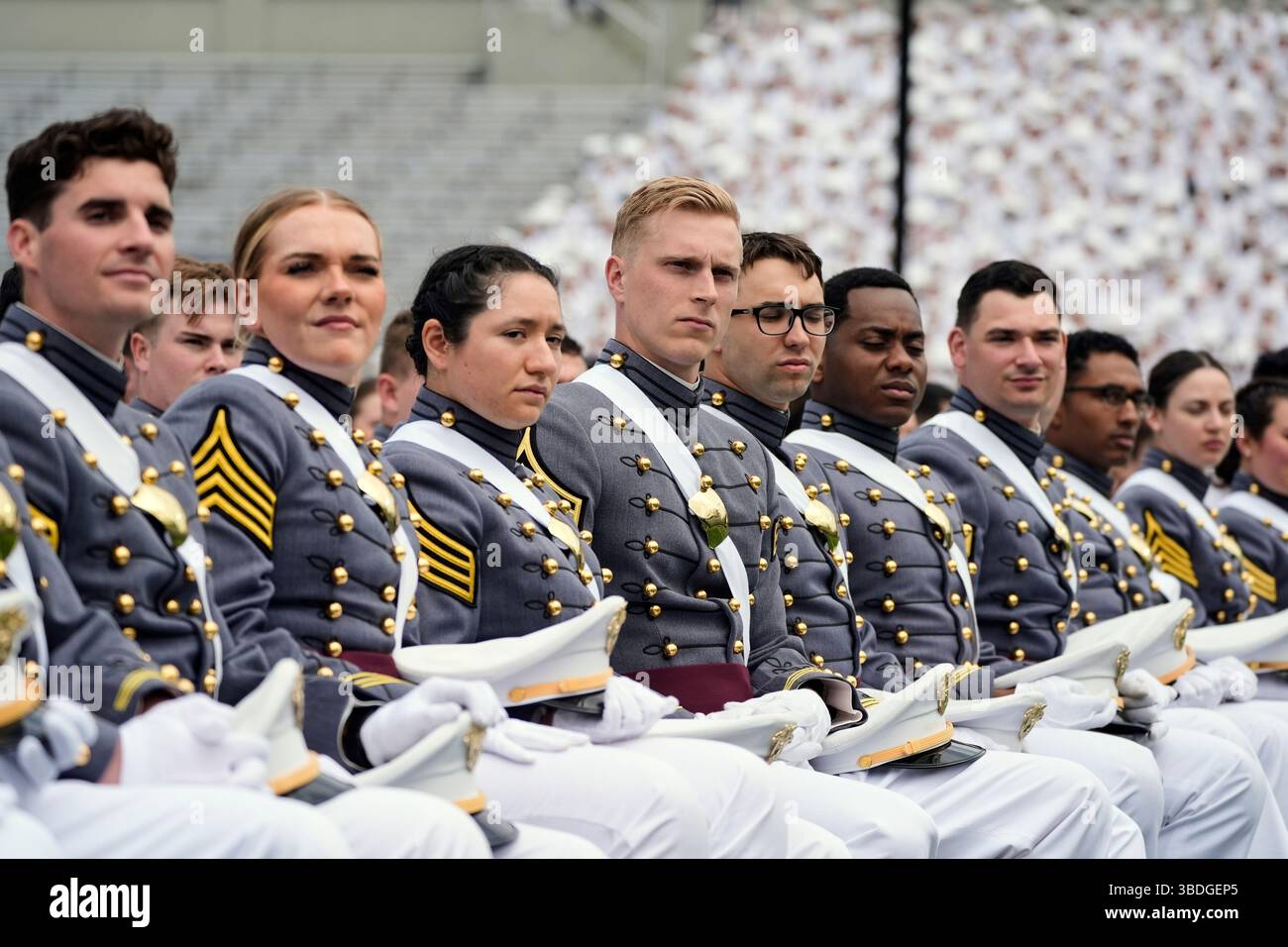 United States Military Academy graduating cadets sit during ...