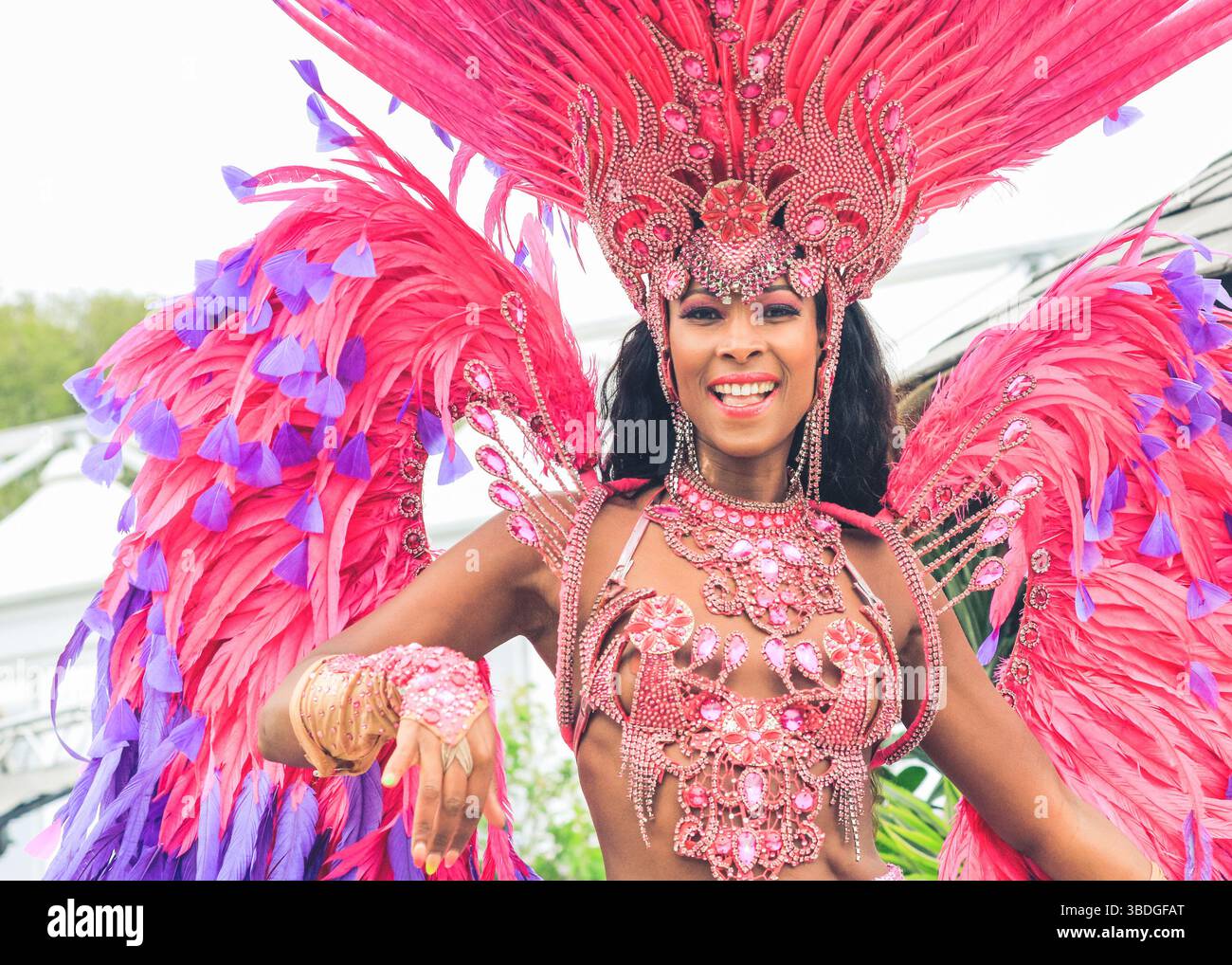 Female carnival dancer and samba performer in colourful outfit, Chelsea Flower Show, London, UK ...