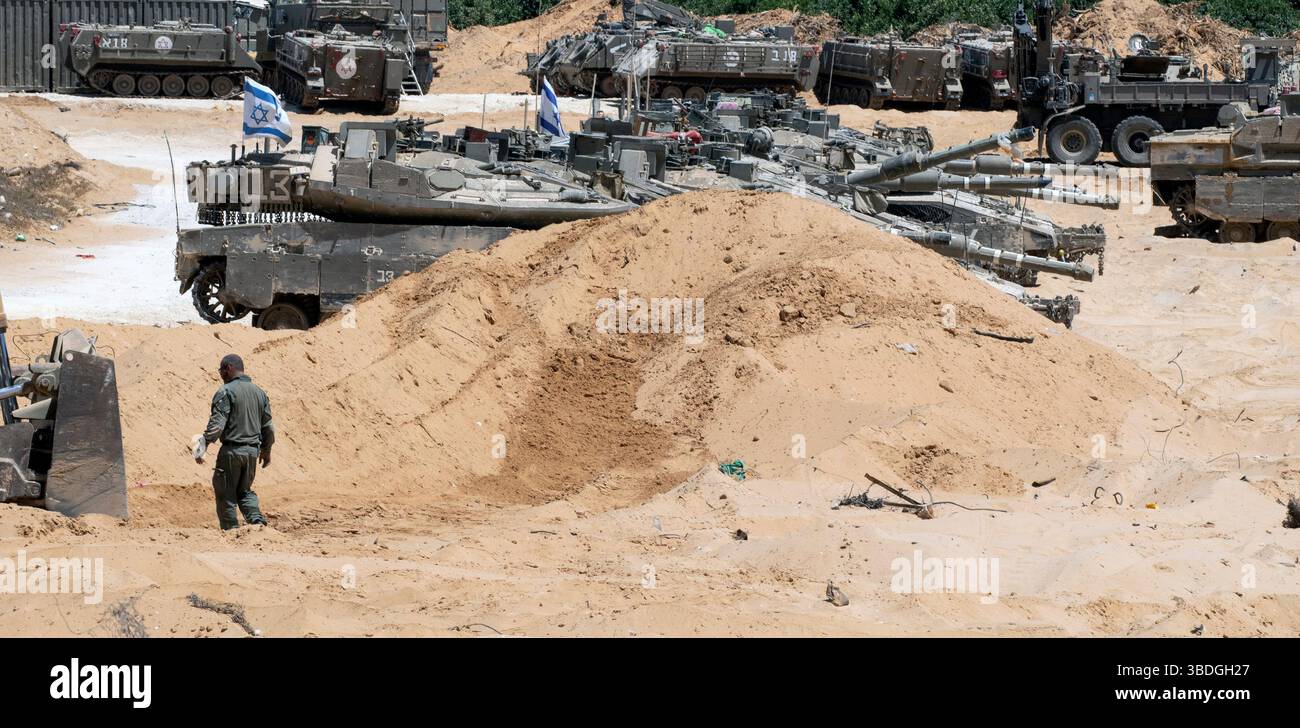 Southern Israel, Israel. 24th May, 2025. An Israeli soldier passes a ...