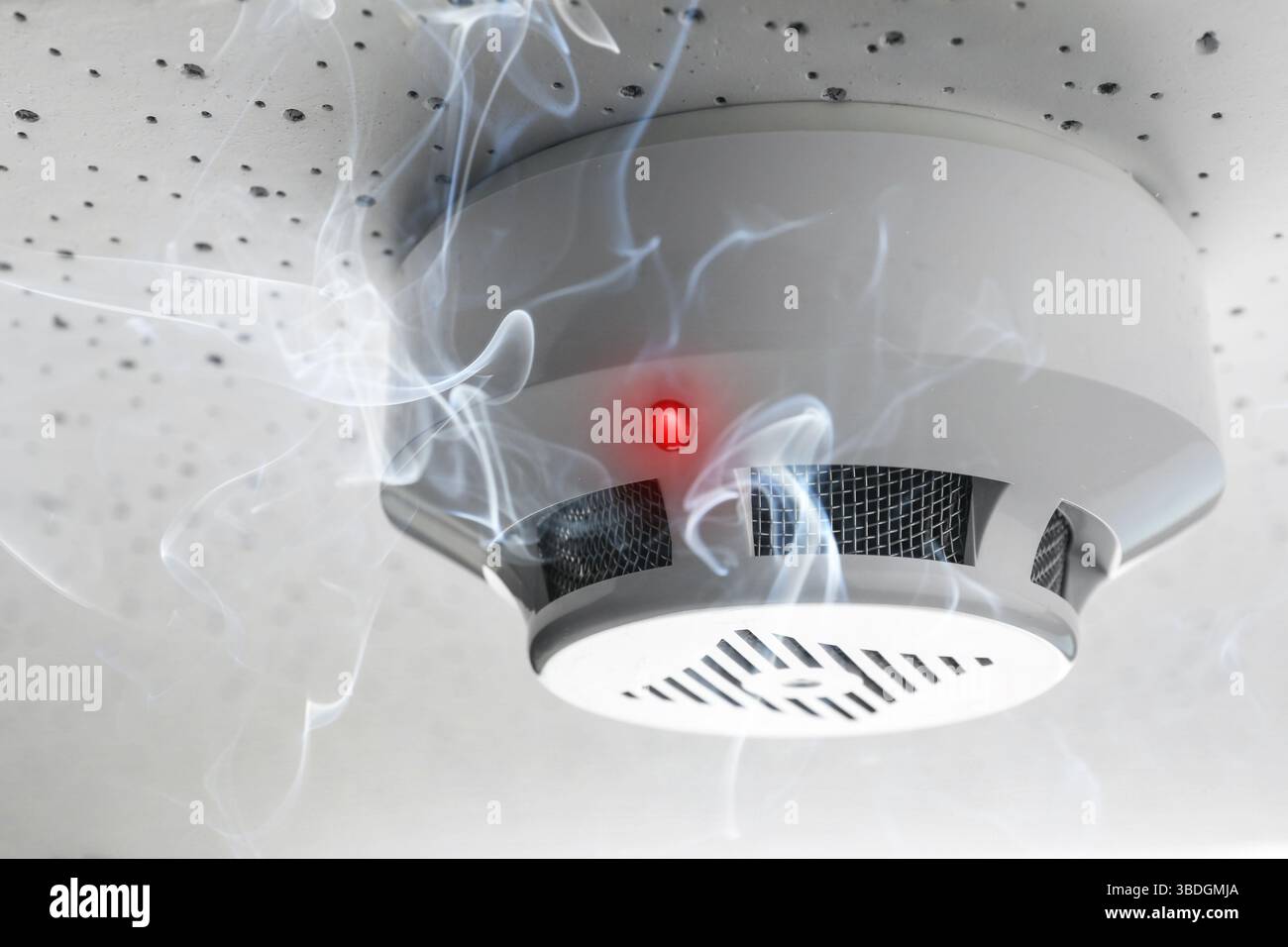 Fire alarm system. Detector on ceiling triggered by smoke Stock Photo ...