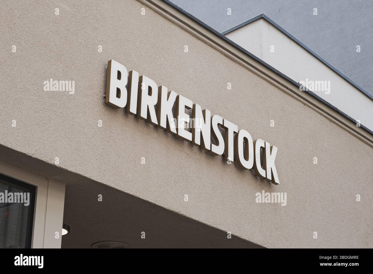 Shoe manufacturer Birkenstock logo on the exterior of a building Stock ...