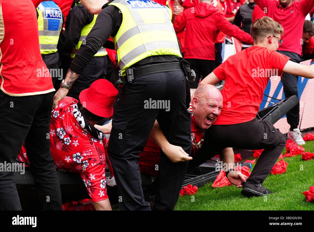 Aberdeen fans invade the pitch after thier team scored a late equaliser ...