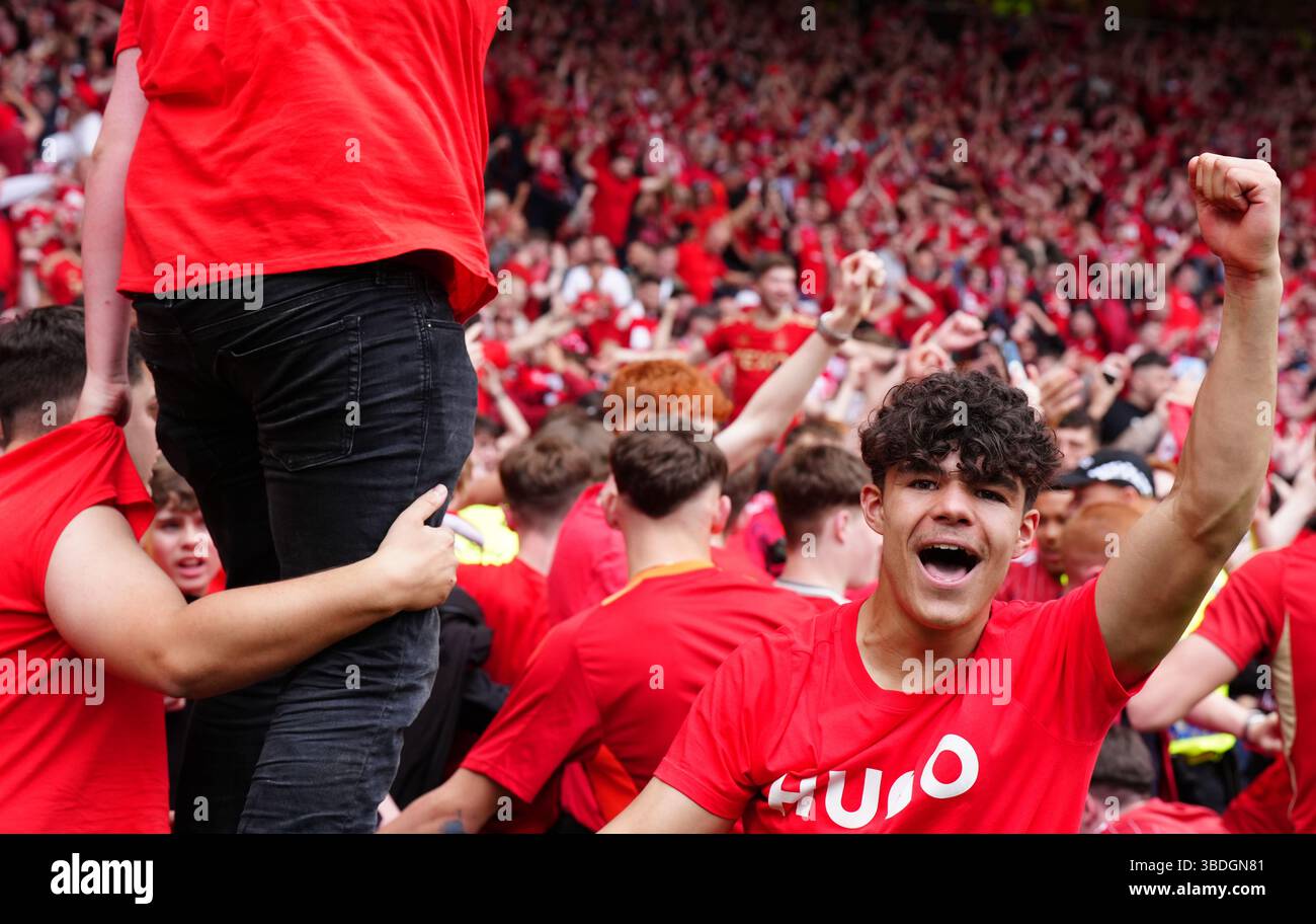 Aberdeen fans invade the pitch after thier team scored a late equaliser ...