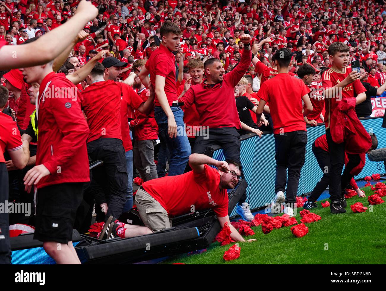 Aberdeen fans invade the pitch after thier team scored a late equaliser ...