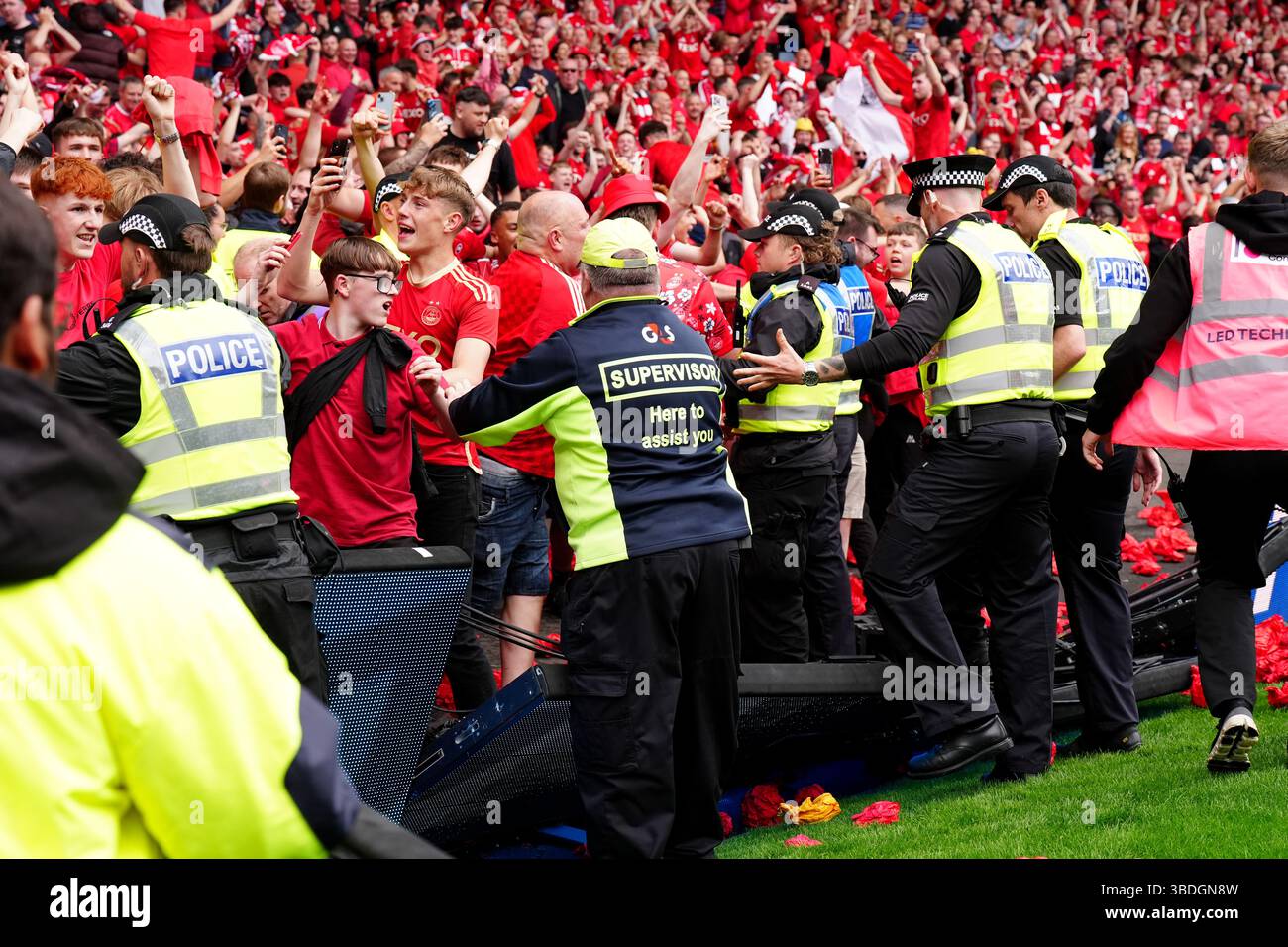 Aberdeen fans invade the pitch after thier team scored a late equaliser ...