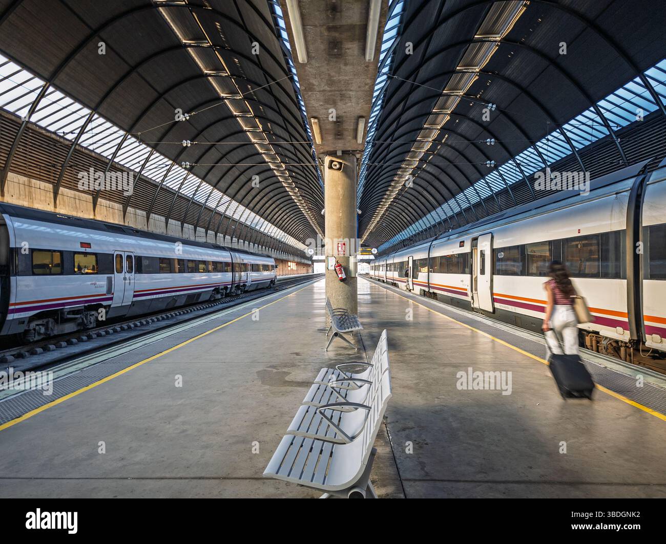 Travelers move through the spacious platforms of Santa Justa Railroad ...