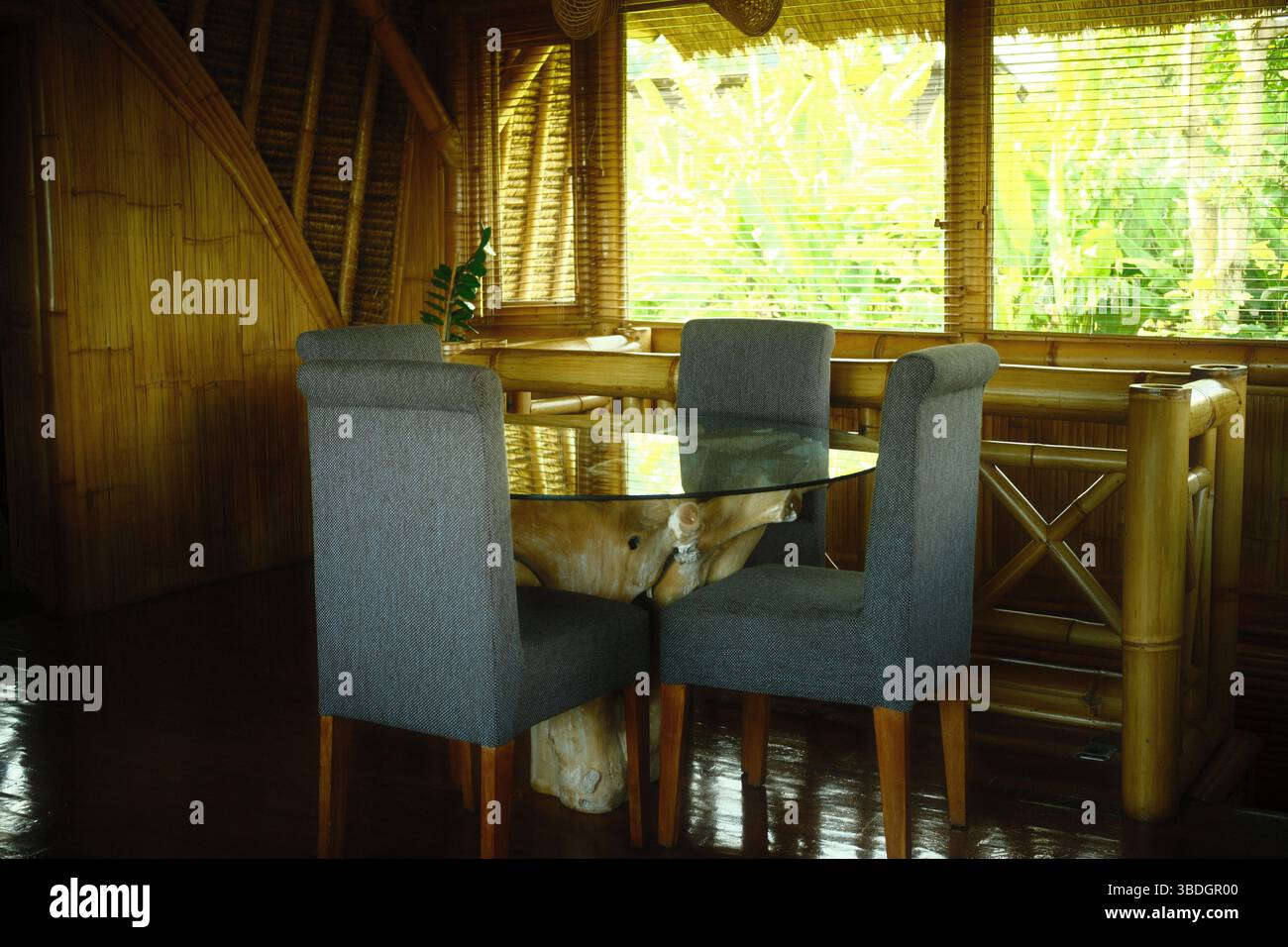 Cozy Indoor Dining Area with a Natural Bamboo Aesthetic Stock Photo - Alamy