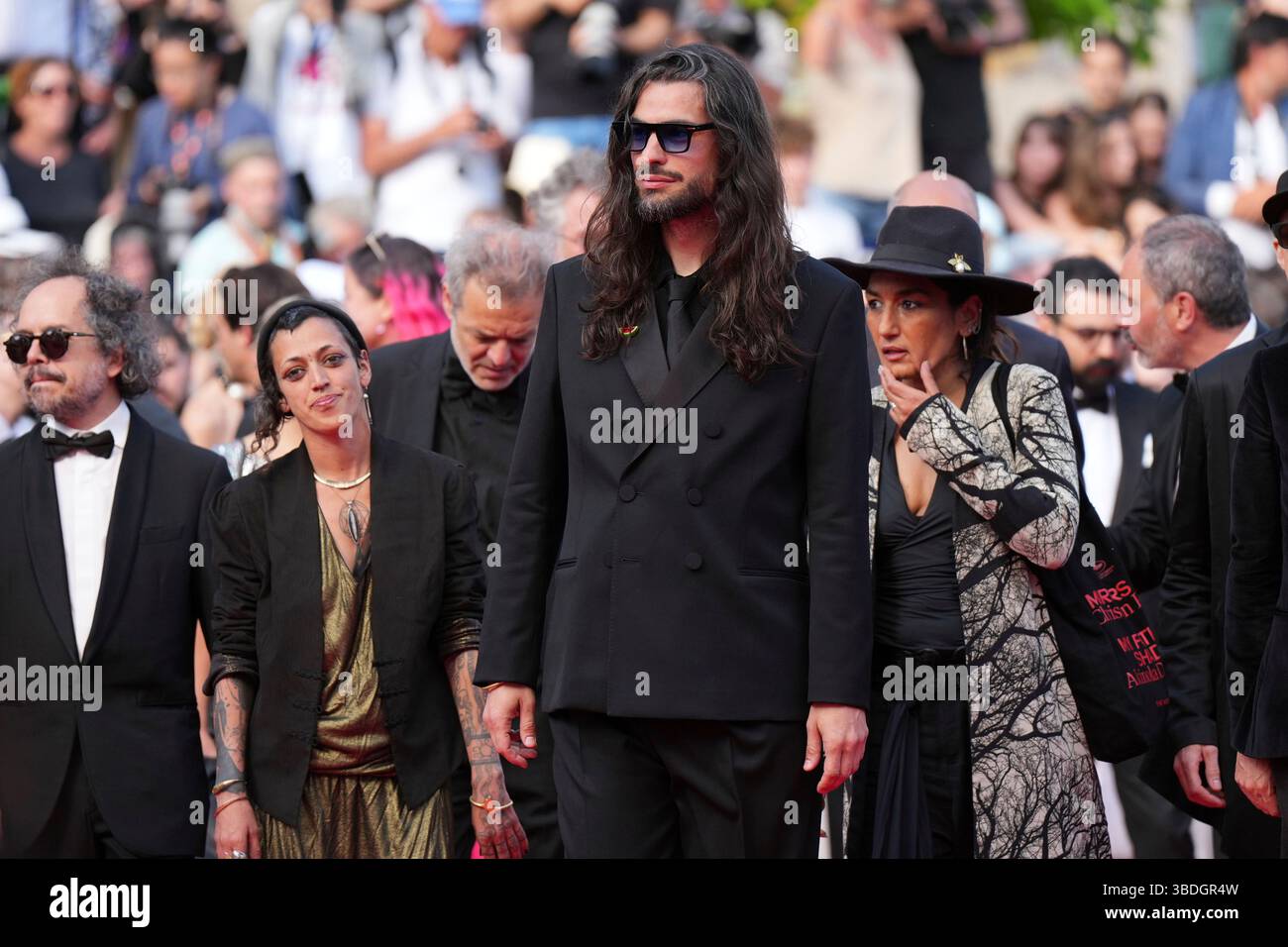 Jade Oukid, second from left, and Oliver Laxe pose for photographers during the awards ceremony ...