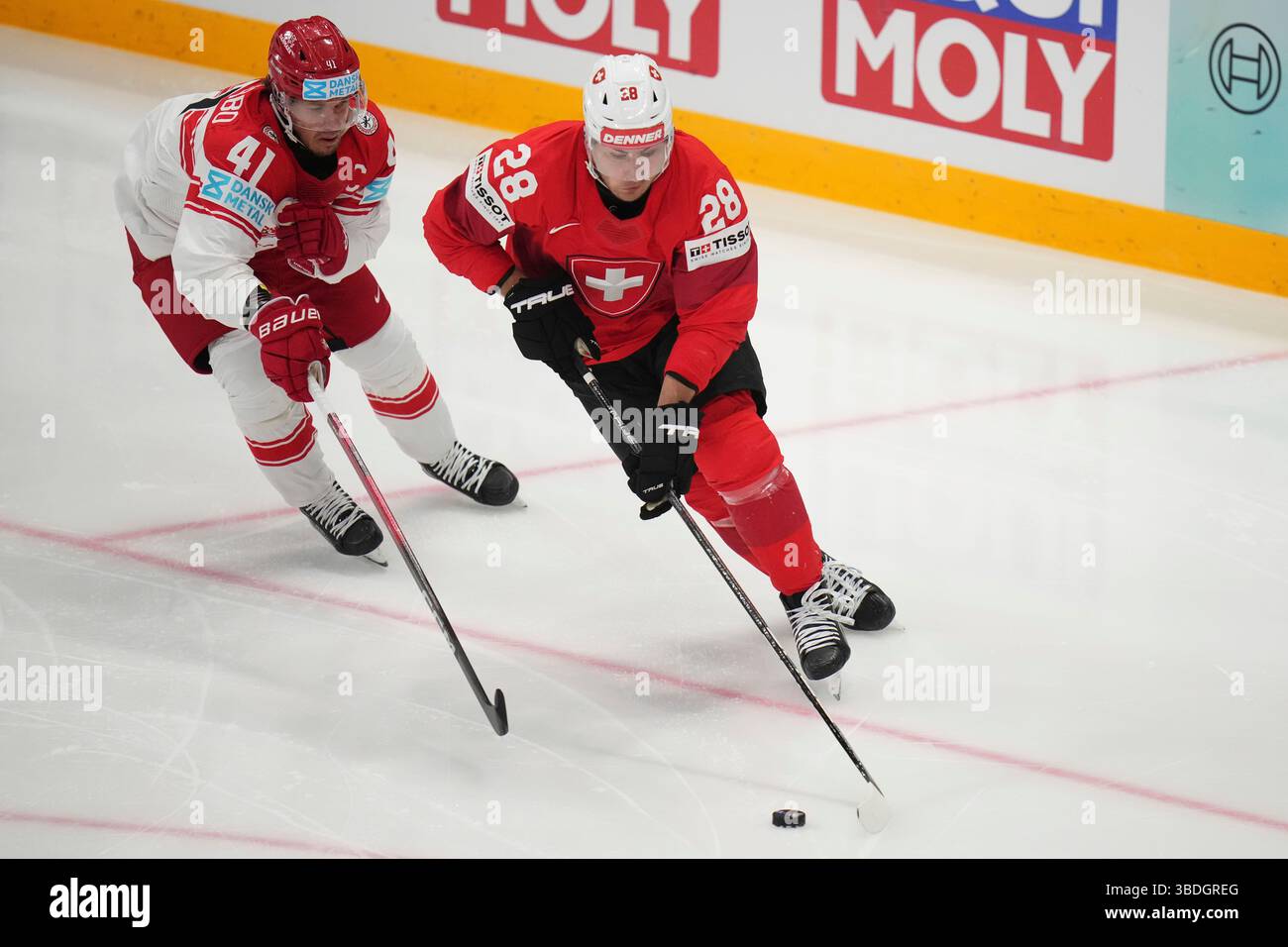 Switzerland's Timo Meier in action by Denmark's Jesper Jensen Aabo ...