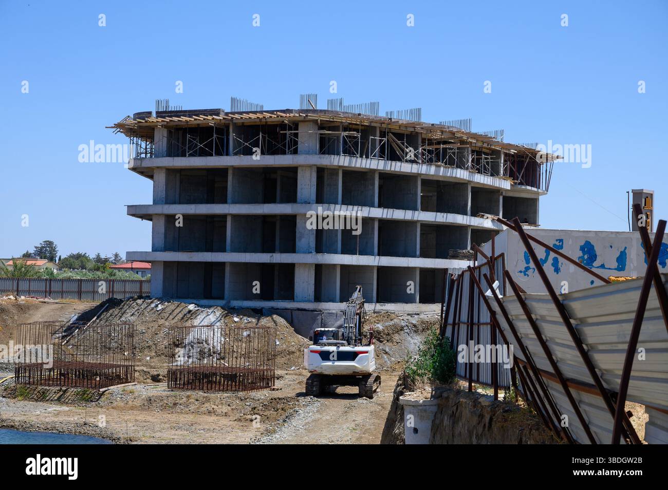 Excavator at Construction Site with Building Under Construction in ...