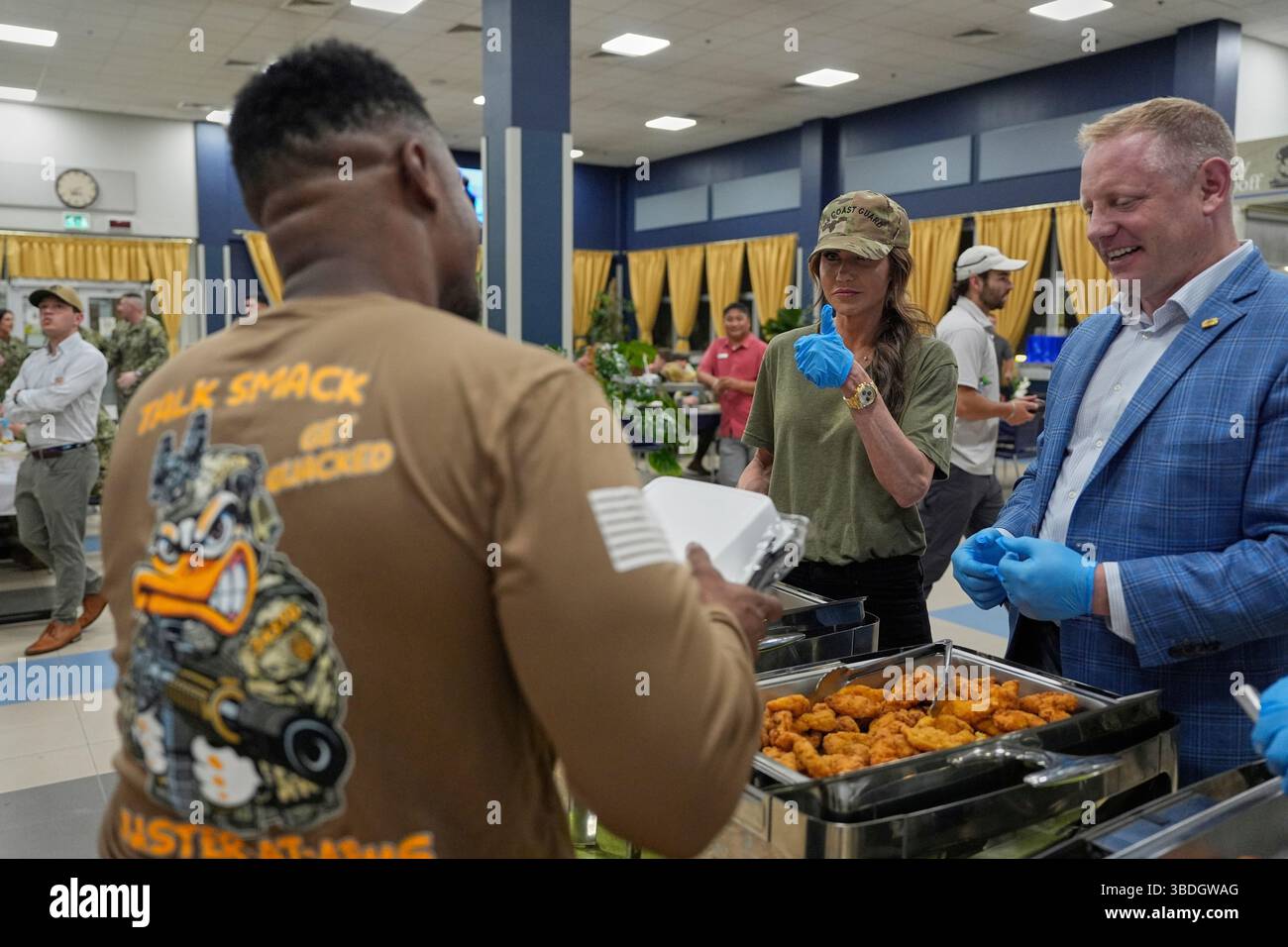 U.S. Homeland Security Secretary Kristi Noem, center, and Sean Plankey ...