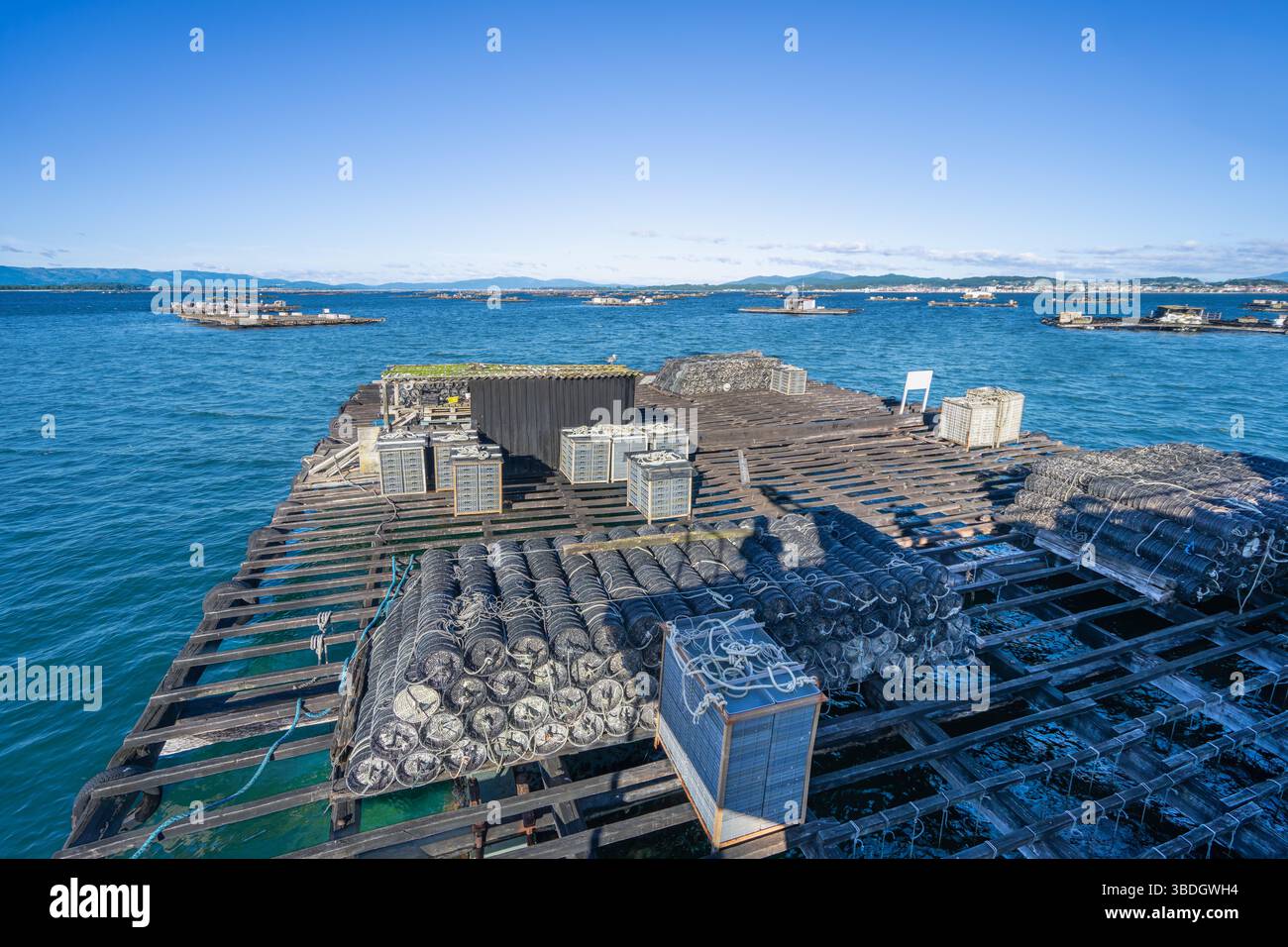 Mussel farming rafts on the clear saltwater river in Combarro, Spain ...