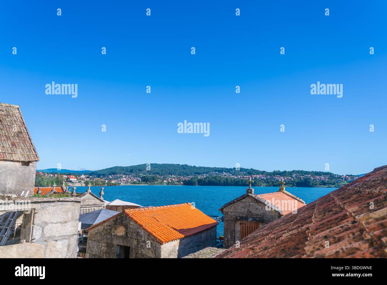 This image captures the picturesque coastal town of Combarro, Spain ...