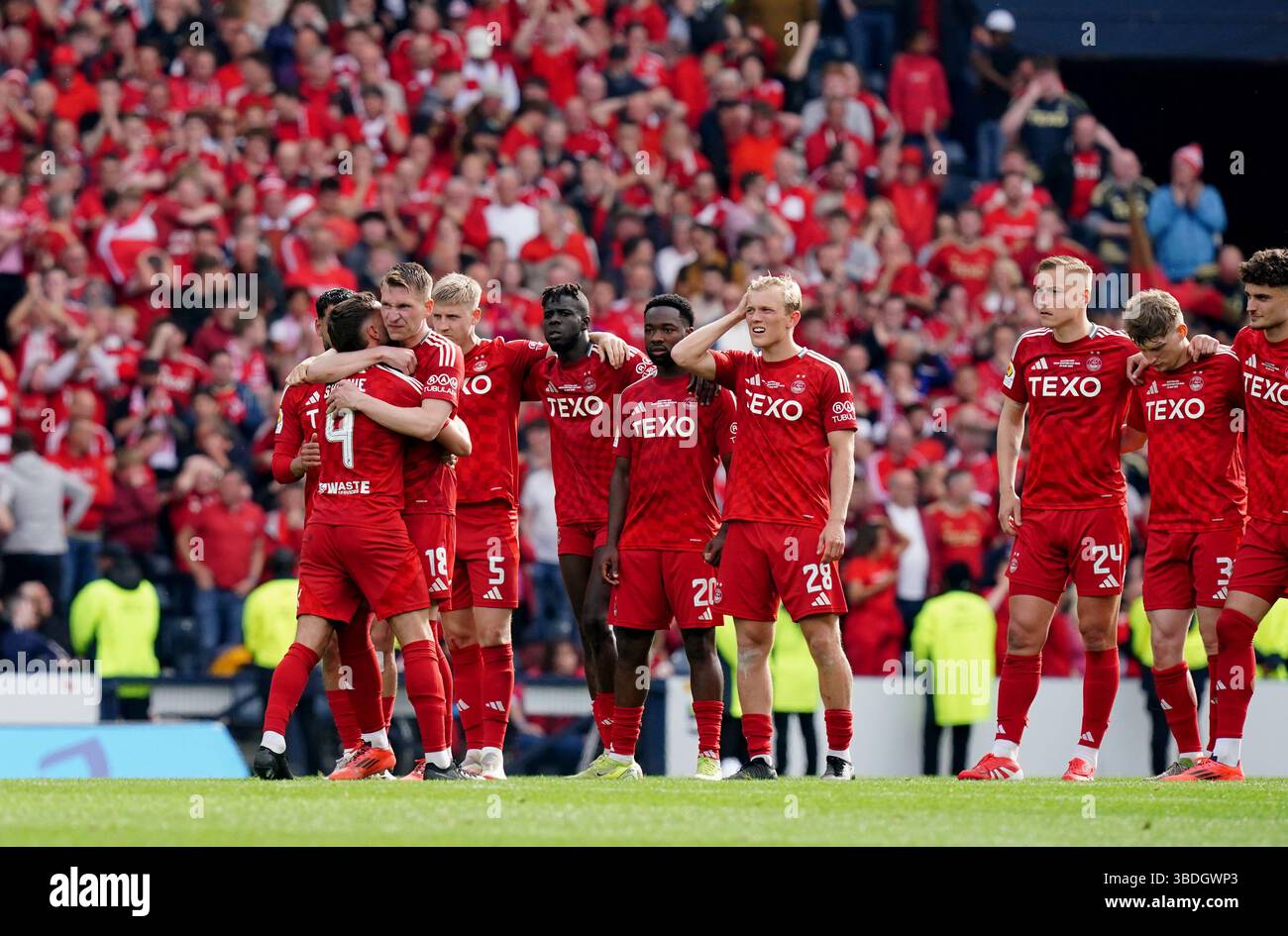 Aberdeen's Graeme Shinnie (left) celebrates with his team mates after ...
