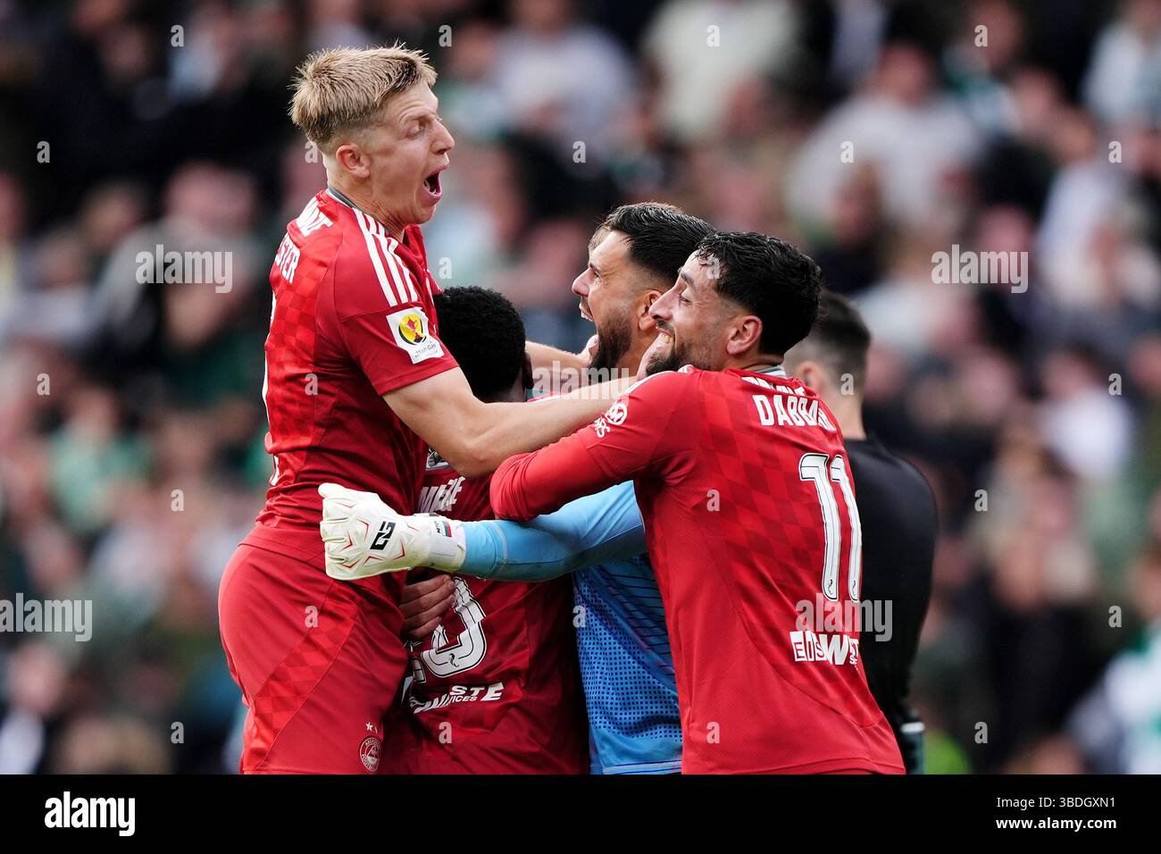 Aberdeen goalkeeper Dimitar Mitov (centre) celebrates with team-mates ...