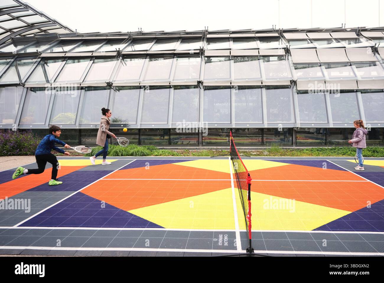 Fans play tennis outside the Simonne-Mathieu court at the Roland Garros ...