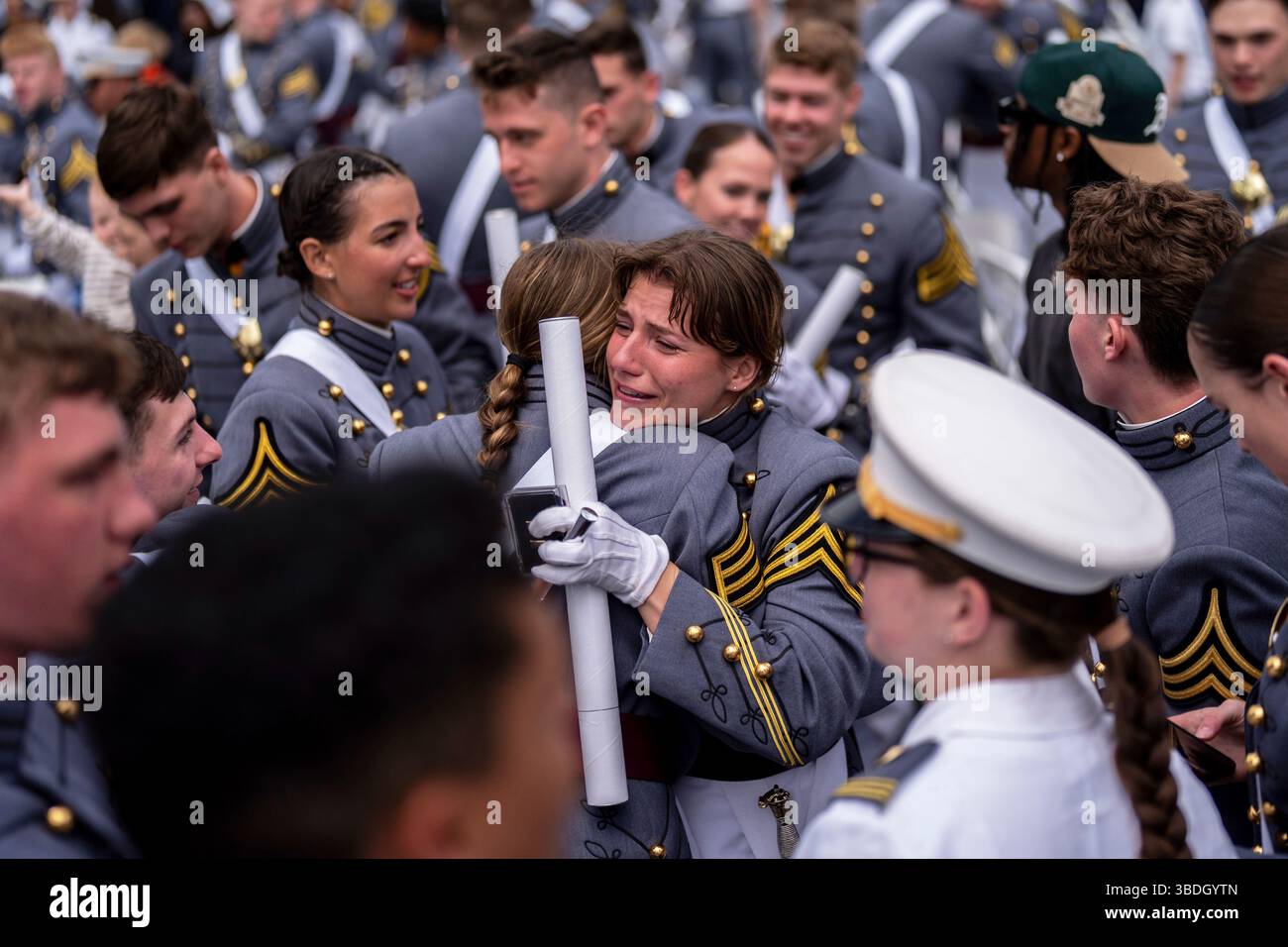 United States Military Academy graduating cadets embrace at the end of ...