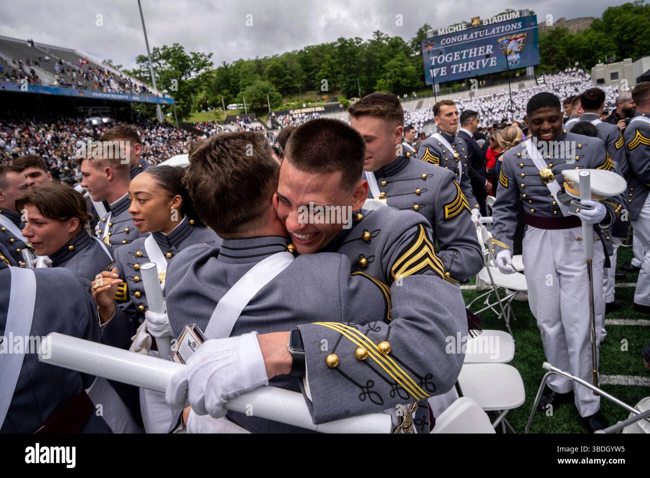 United States Military Academy graduating cadets embrace at the end of ...