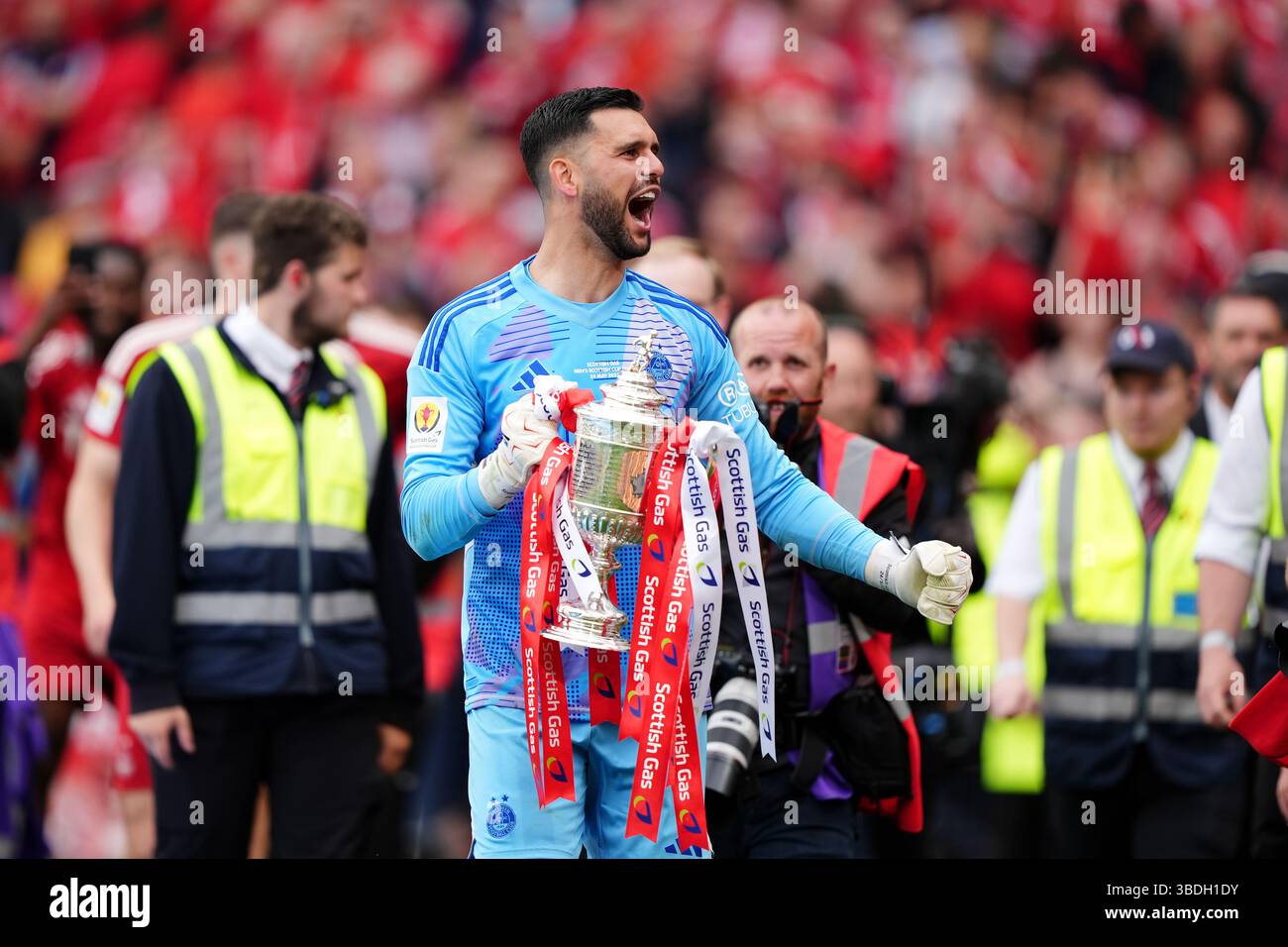 Aberdeen goalkeeper Dimitar Mitov celebrates with the trophy after the ...