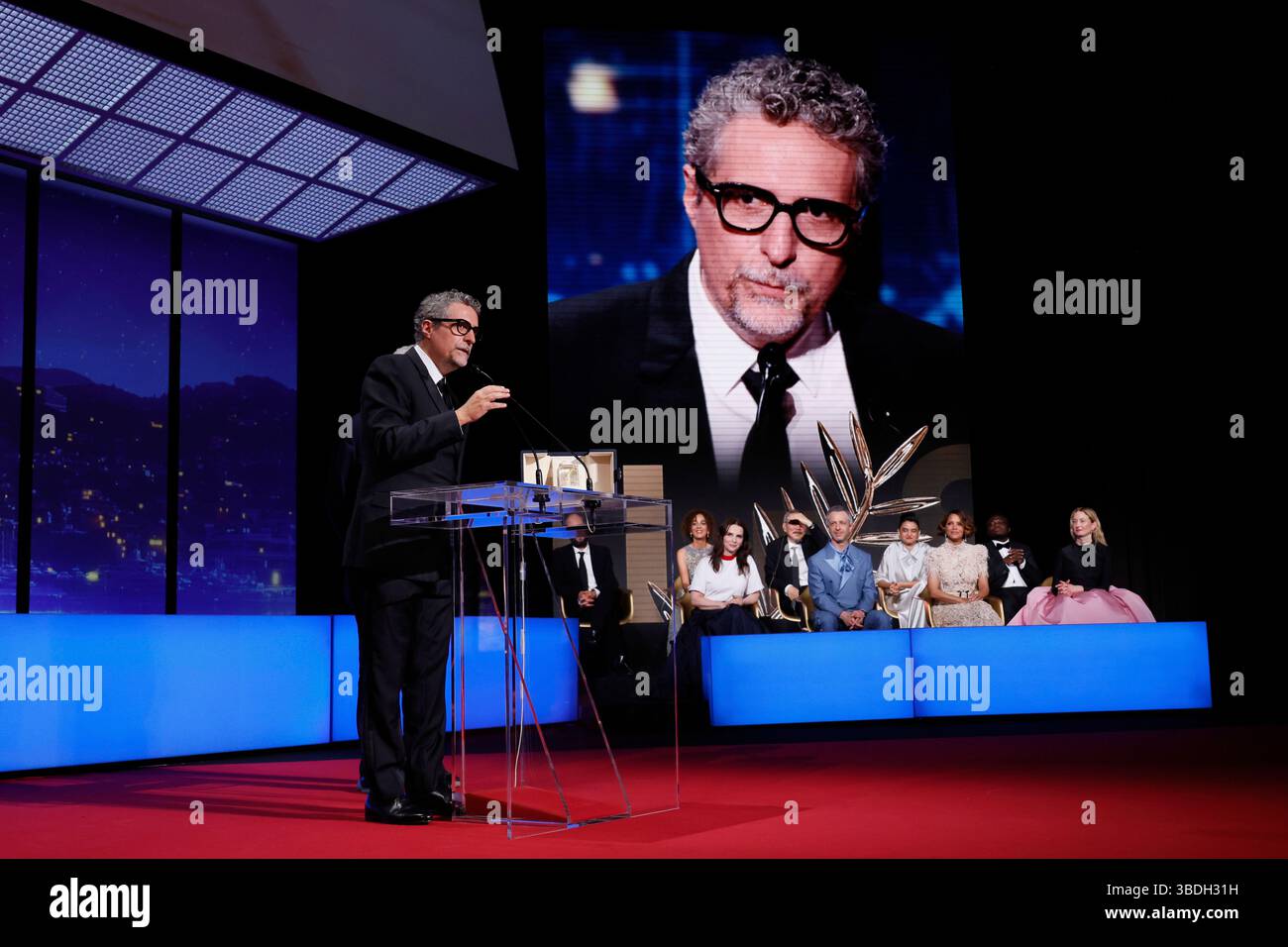 Director Kleber Mendonca Filho, accepts the award for best director for ...