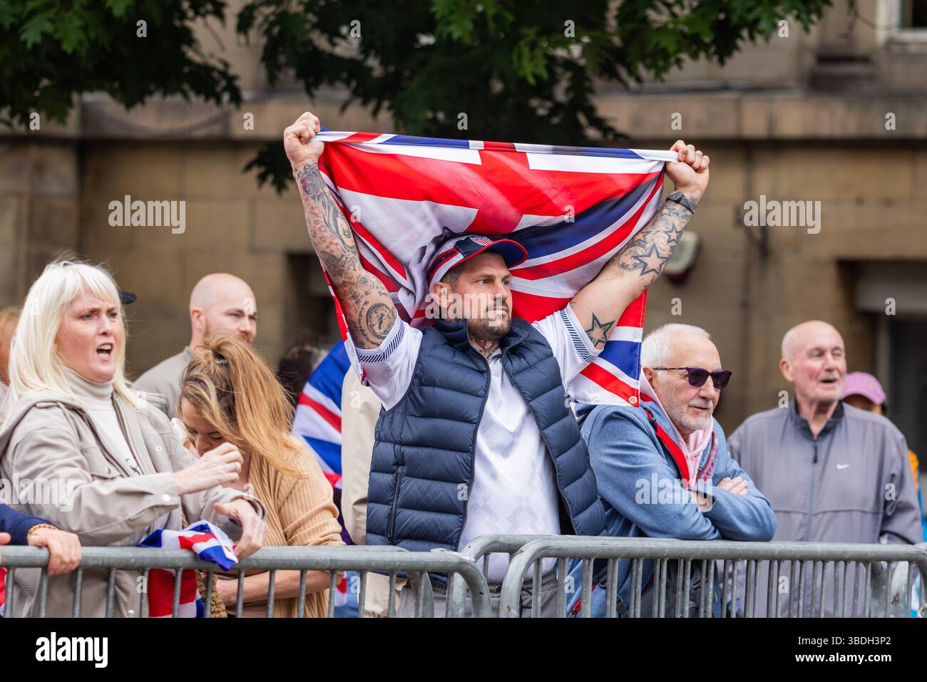 Leeds, UK. 24 MAY, 2025. Man holds Union Jack flag as the right-leaning ...