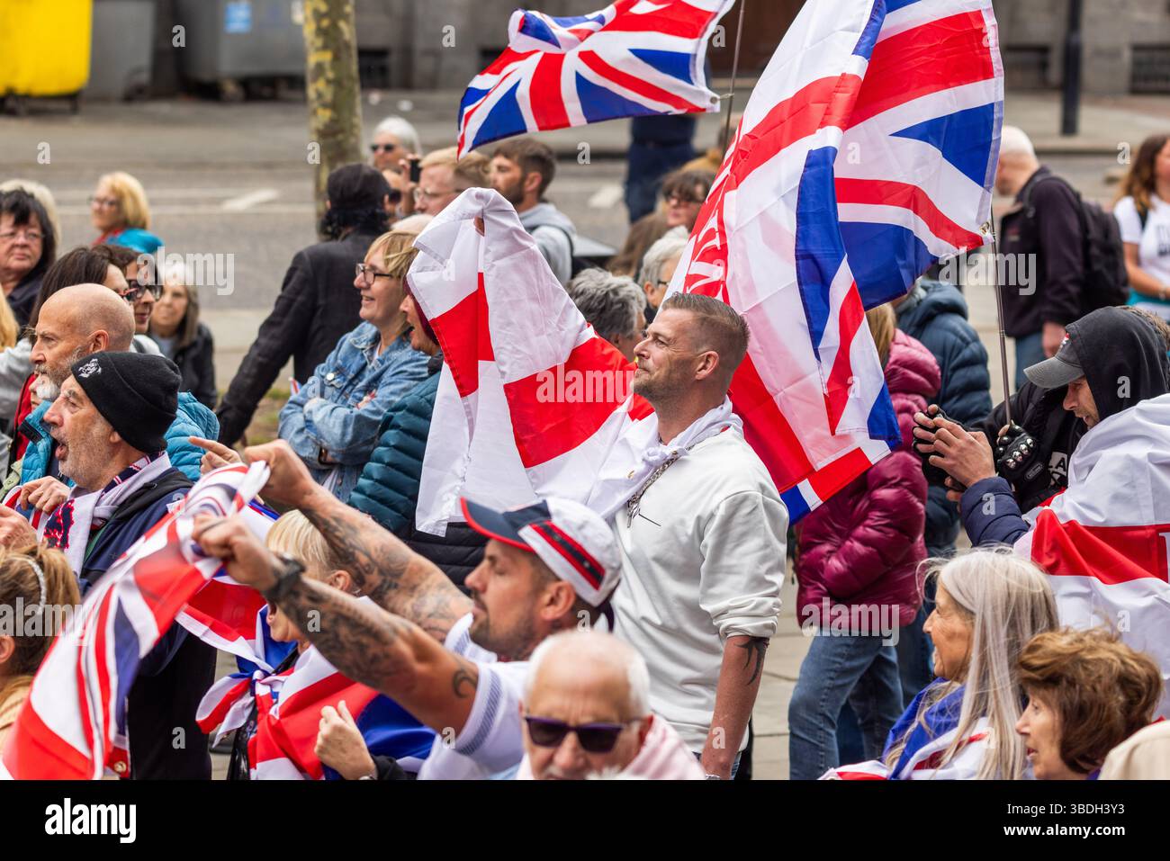 Leeds, UK. 24 MAY, 2025. People gather as the right-leaning "Great ...