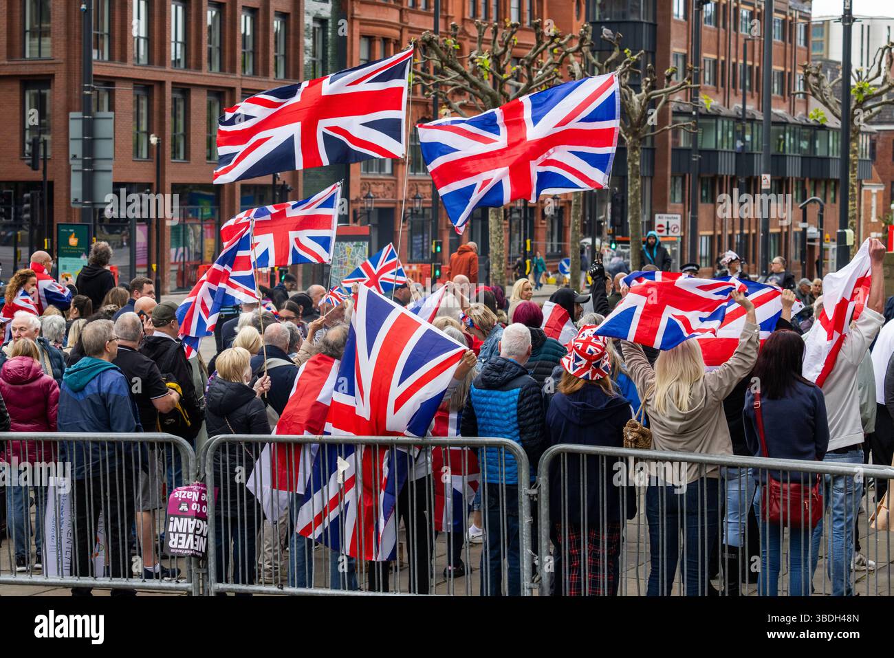 Leeds, UK. 24 MAY, 2025. People gather as the right-leaning "Great ...