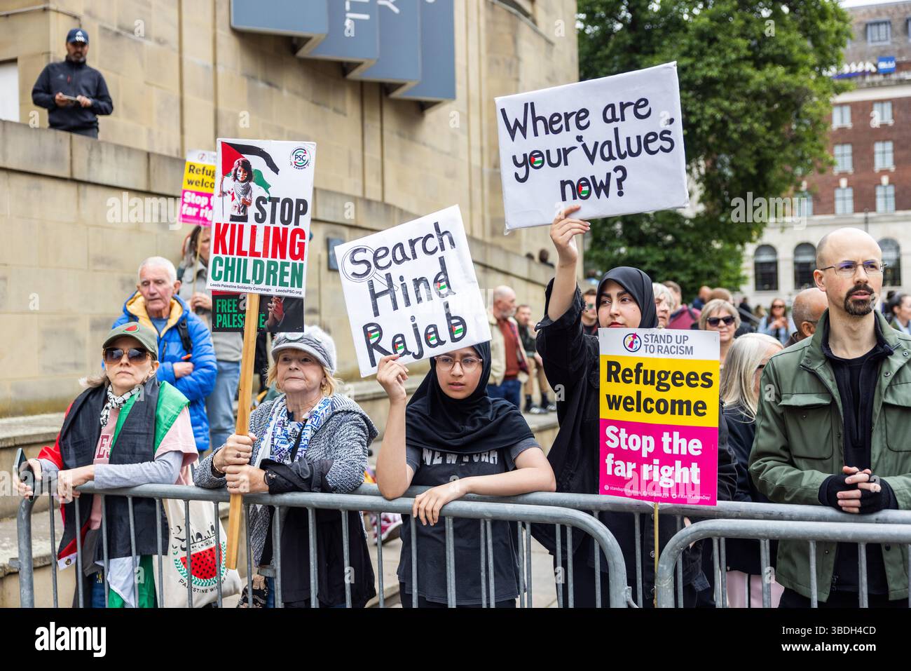 Leeds, UK. 24 MAY, 2025. Left wing counter protestors hold "Hind Rajab ...