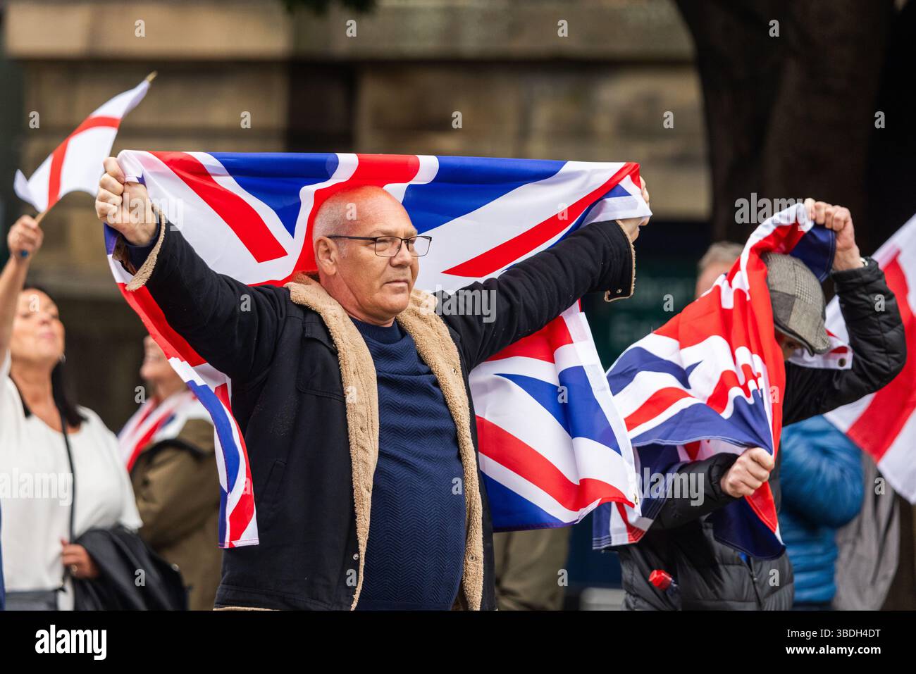 Leeds, UK. 24 MAY, 2025. Man wears Union Jack flag as the right-leaning ...