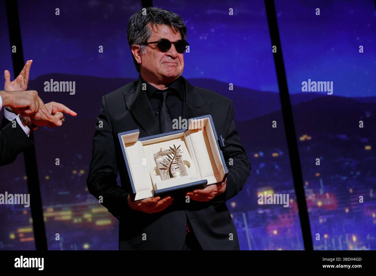 Director Jafar Panahi, accepts the Palme d'Or for the film 'It Was Just ...