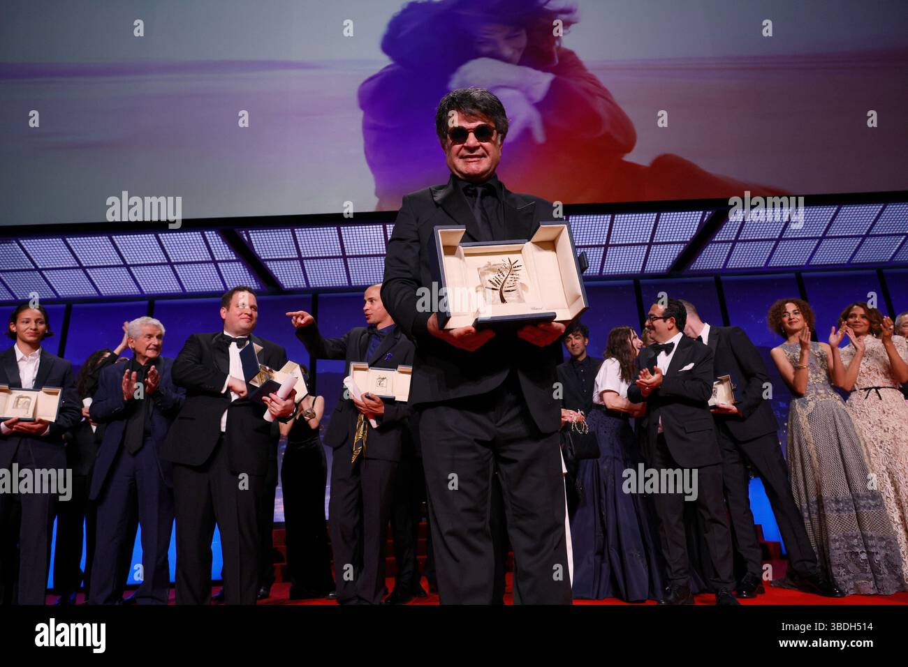 Director Jafar Panahi, accepts the Palme d'Or for the film 'It Was Just ...