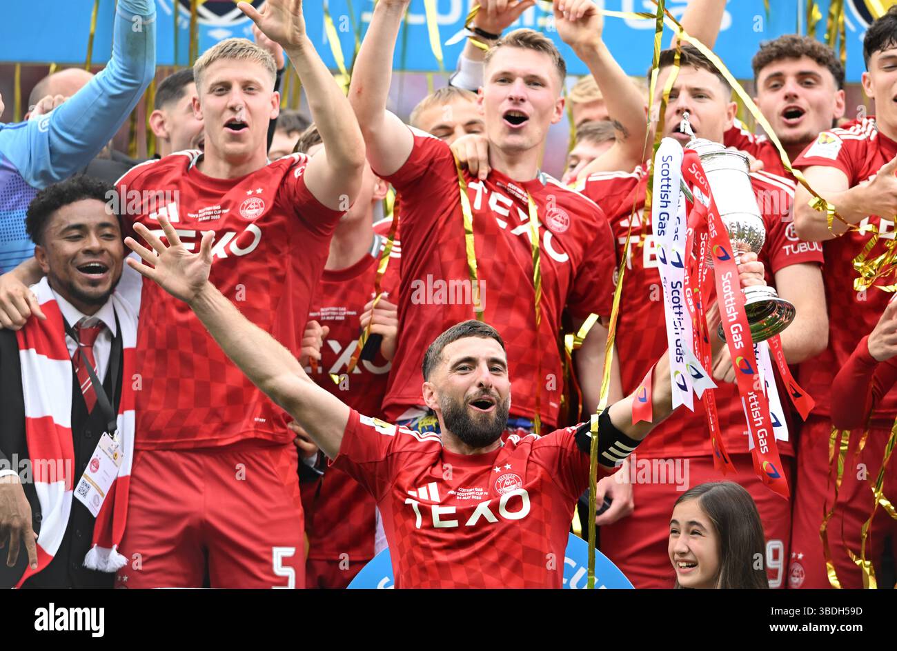 Glasgow, UK. 24th May, 2025. Graeme Shinnie of Aberdeen lifts the ...