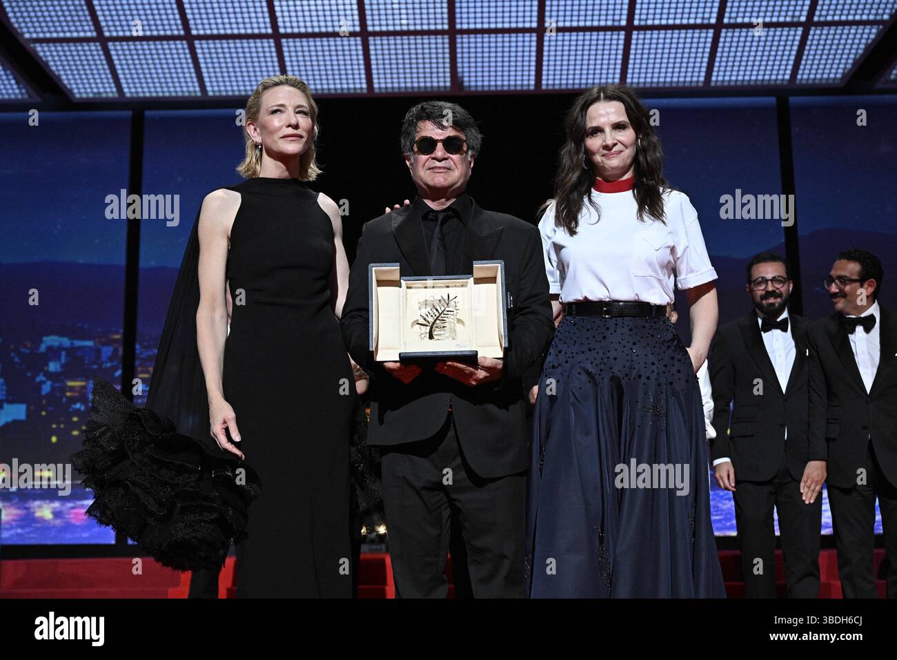Cannes, France. 24th May, 2025. Iranian director and screenwriter and producer Jafar Panahi (C ...