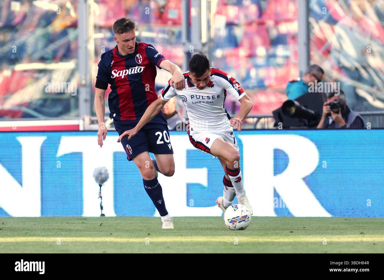 Bologna, Italia. 24th May, 2025. Bologna's Michel Aebischer fights for the ball with Genoa's ...