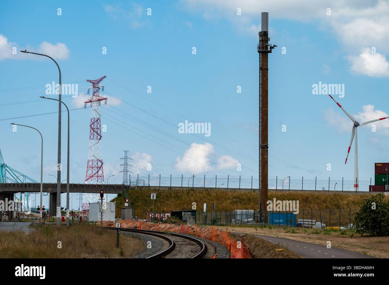 Bending railway track, electricity pole and wind mill at the Antwerp ...