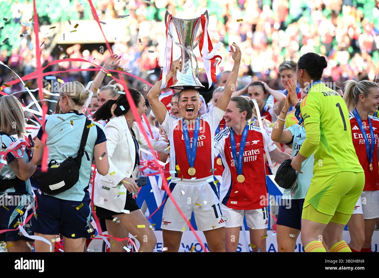 Arsenal's Katie McCabe (centre) celebrates with the trophy following ...