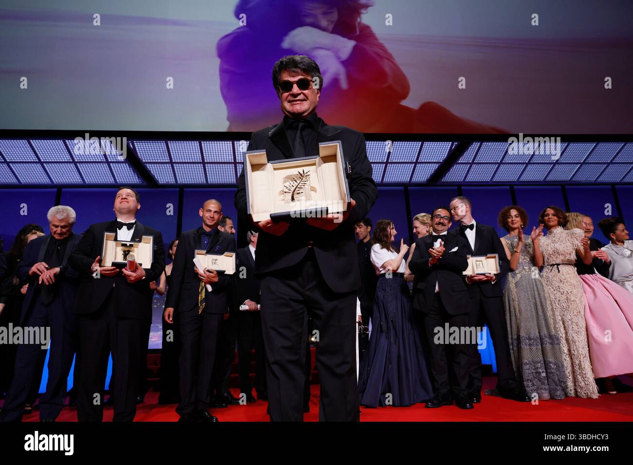 Director Jafar Panahi, accepts the Palme d'Or for the film 'It Was Just ...