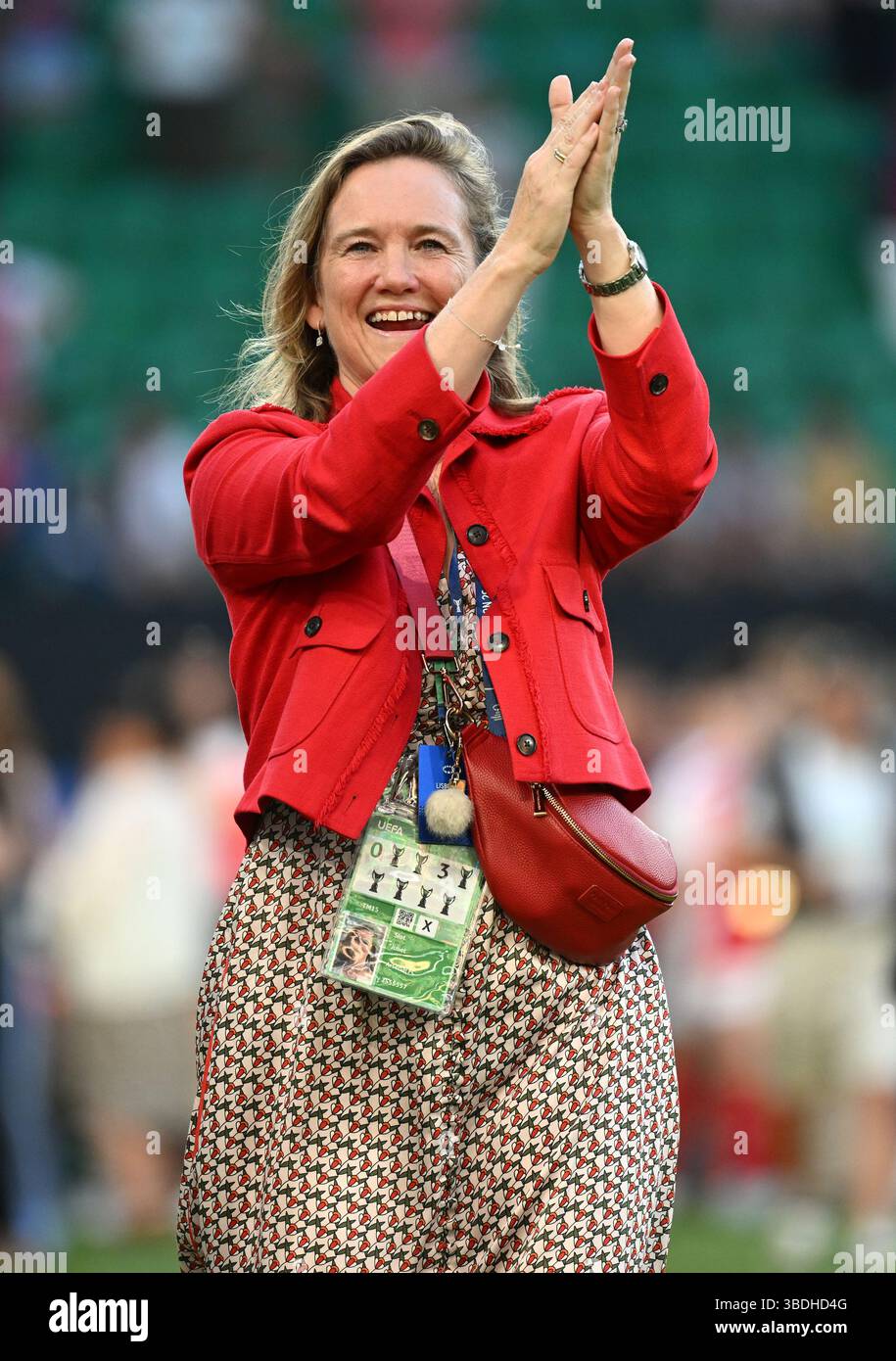 Arsenal chief commercial officer Juliet Slot celebrates on the pitch ...