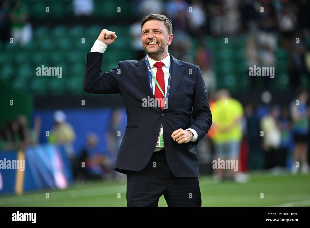 Arsenal managing director Richard Garlick celebrates on the pitch ...