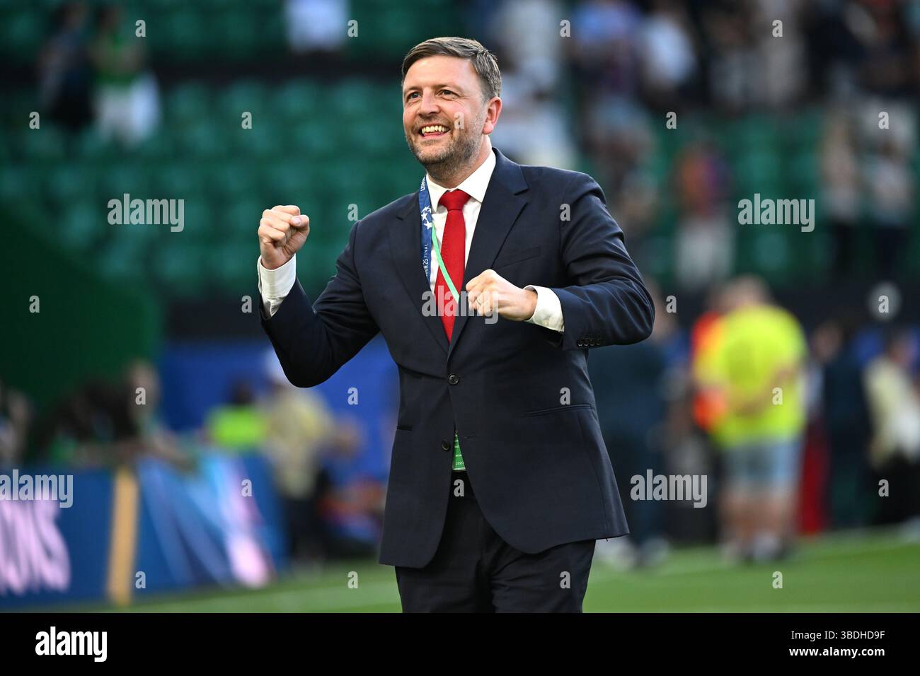 Arsenal managing director Richard Garlick celebrates on the pitch ...