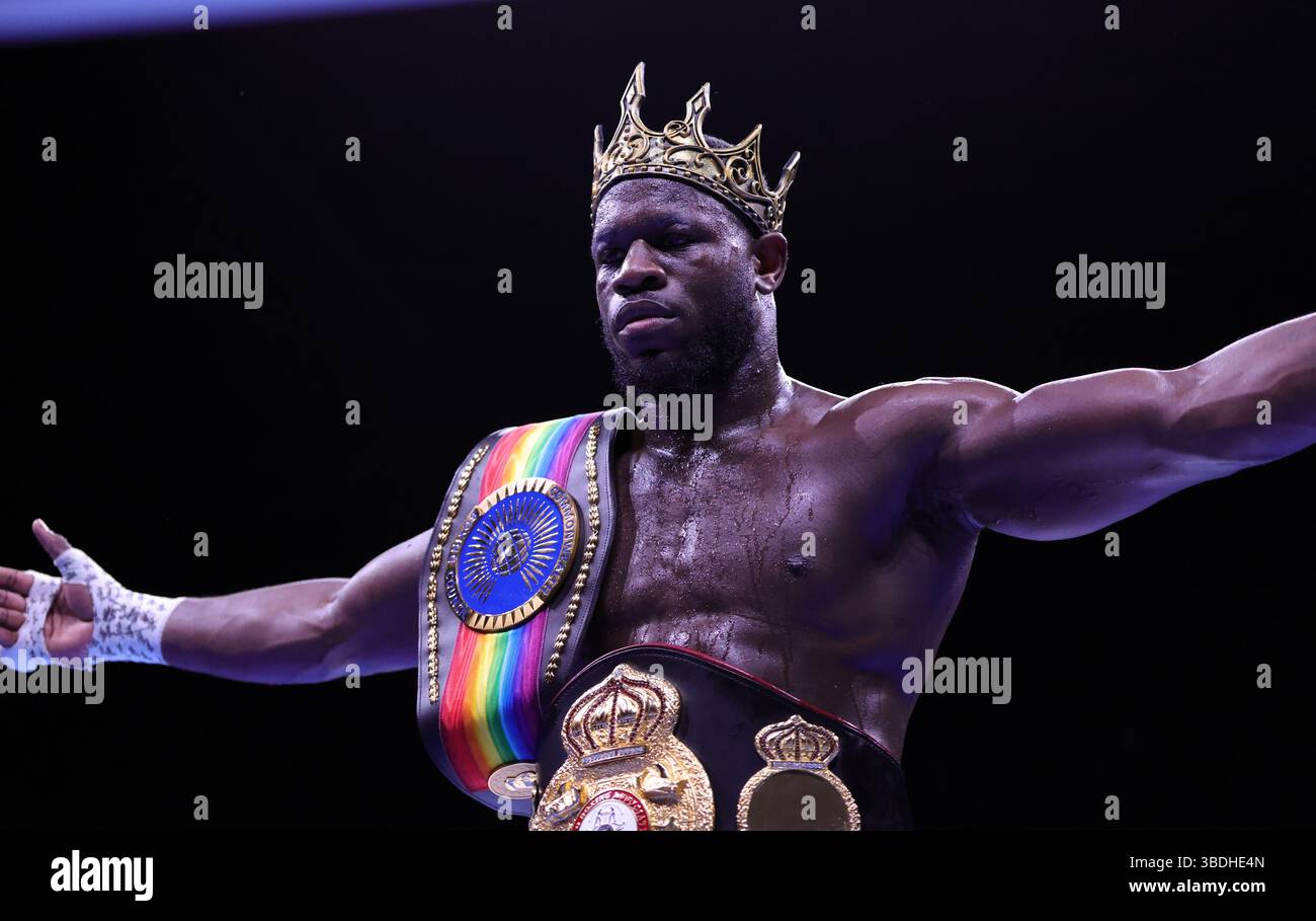 Aloys Youmbi wearing a crown after winning the vacant Commonwealth ...