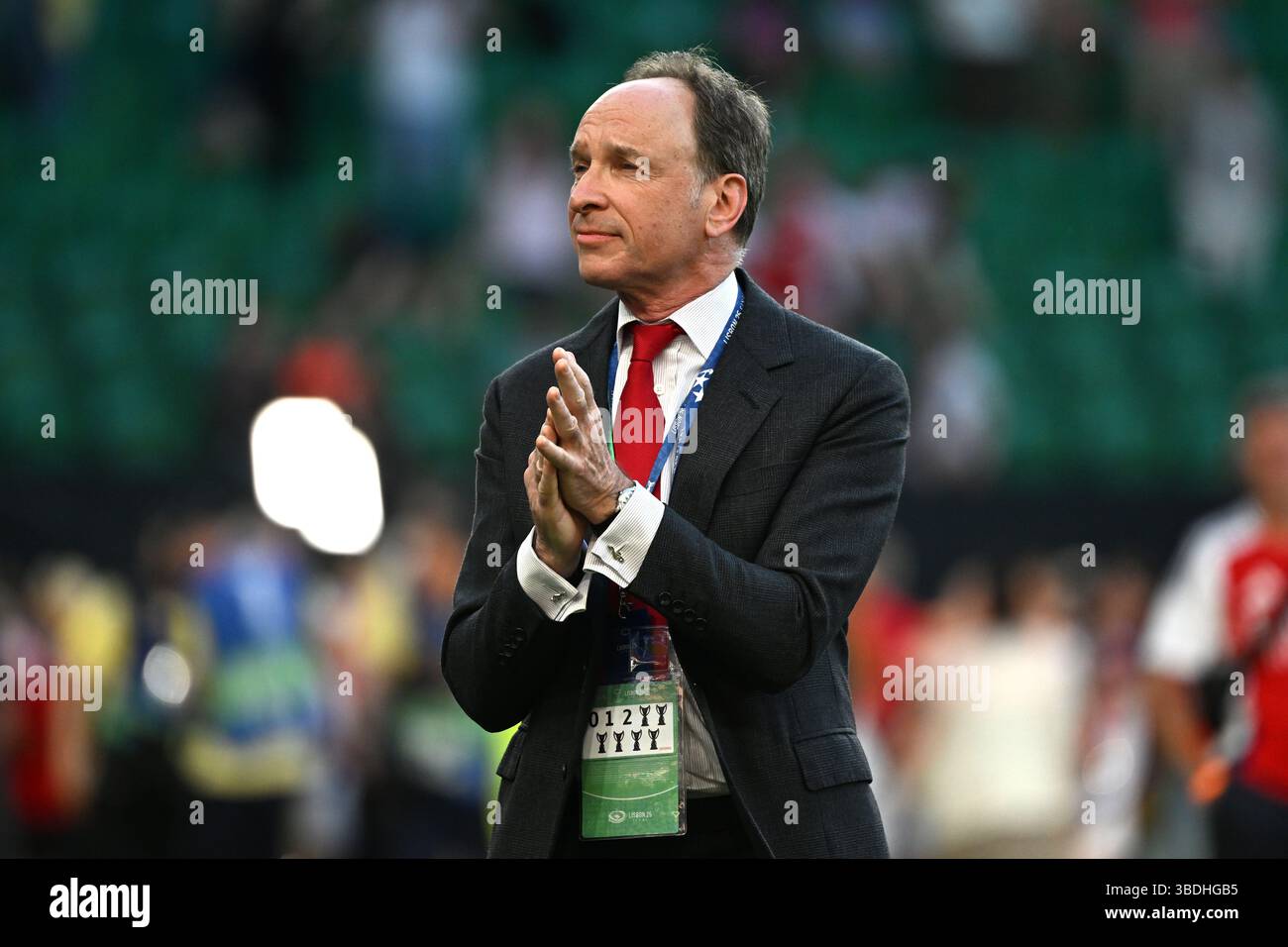 Arsenal executive vice-chair Tim Lewis celebrates on the pitch ...