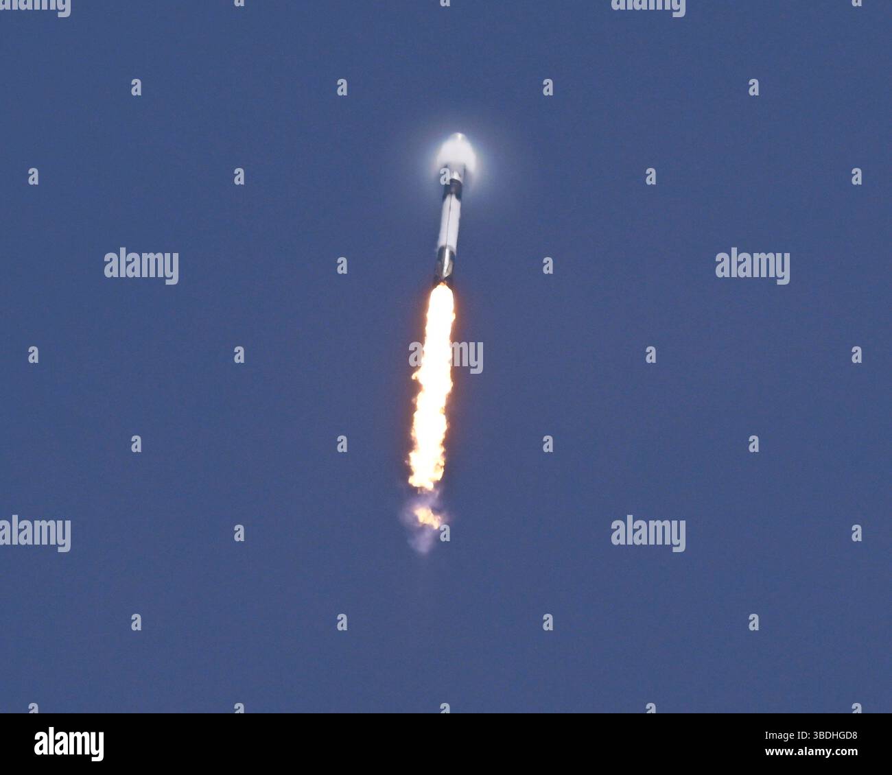 A vapor cone forms as the SpaceX Falcon 9 rocket goes supersonic as it ...