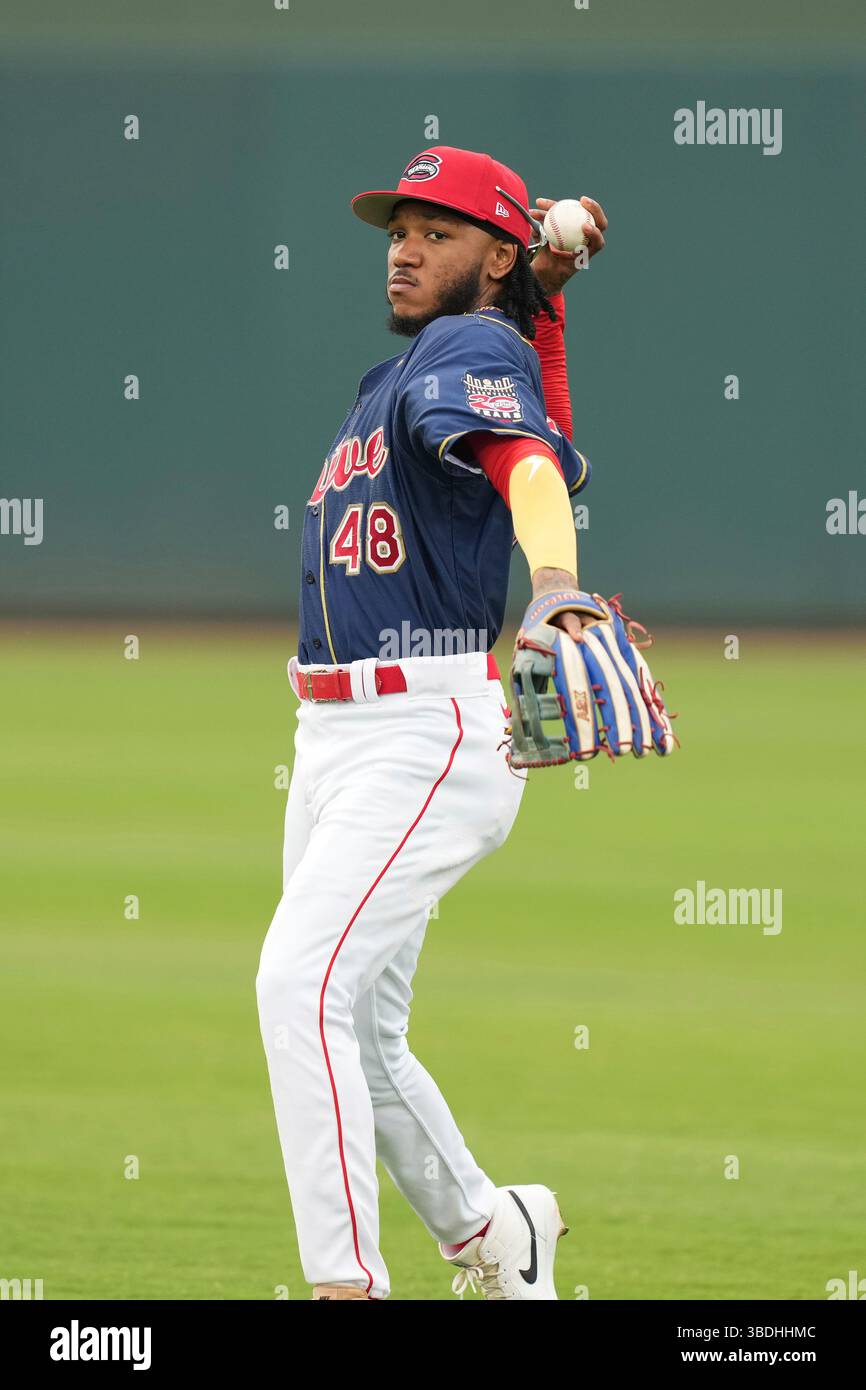 Miguel Bleis (48) of the Greenville Drive warms up before a South ...
