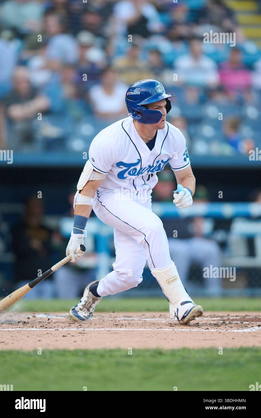 Asheville Tourists Joseph Sullivan (10) follows through on a swing ...