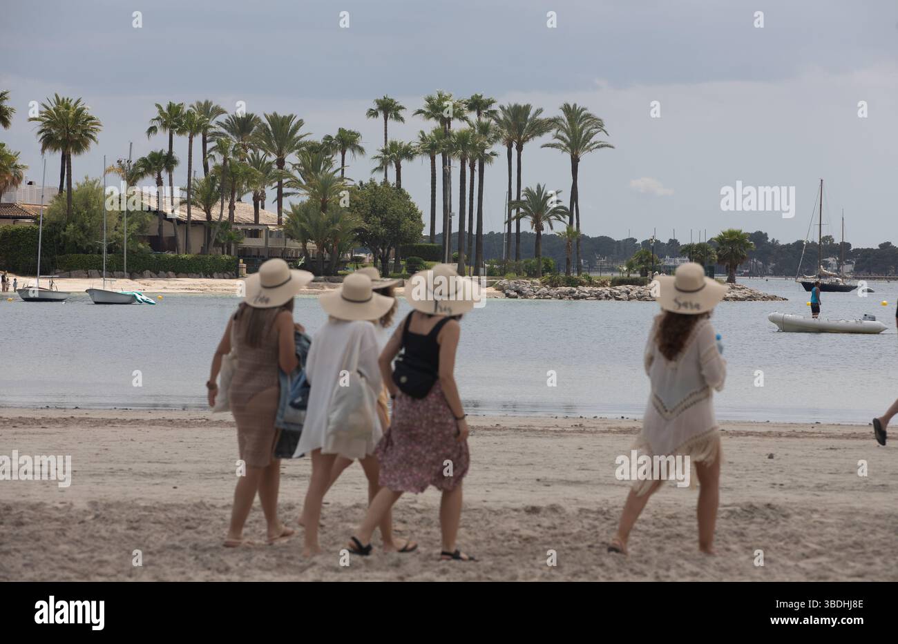 Alcudia, Spain. 24th May, 2025. People enjoy the sunny weather on the ...